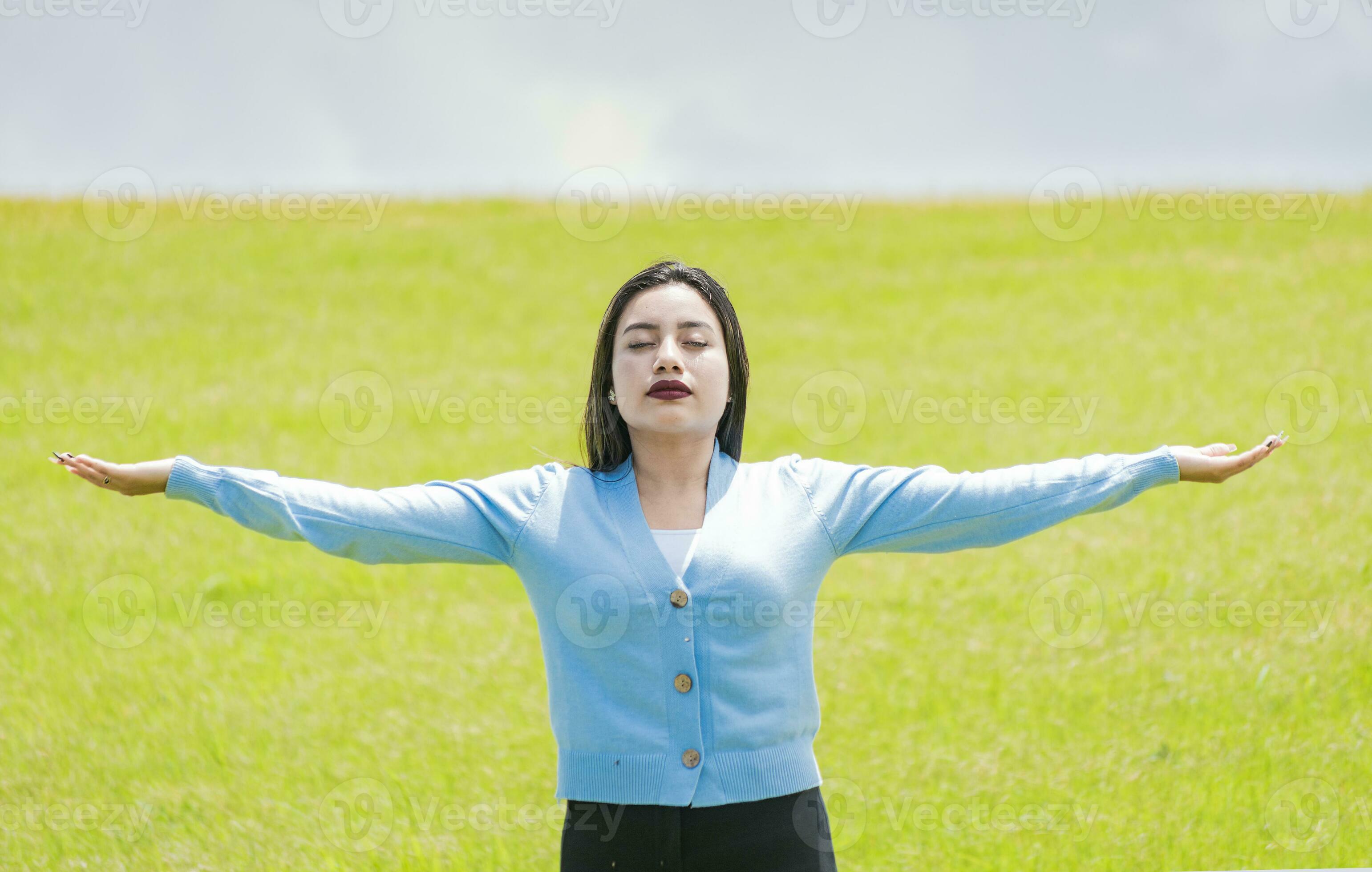 A Girl Spreading Her Arms In The Field Attractive Young Woman