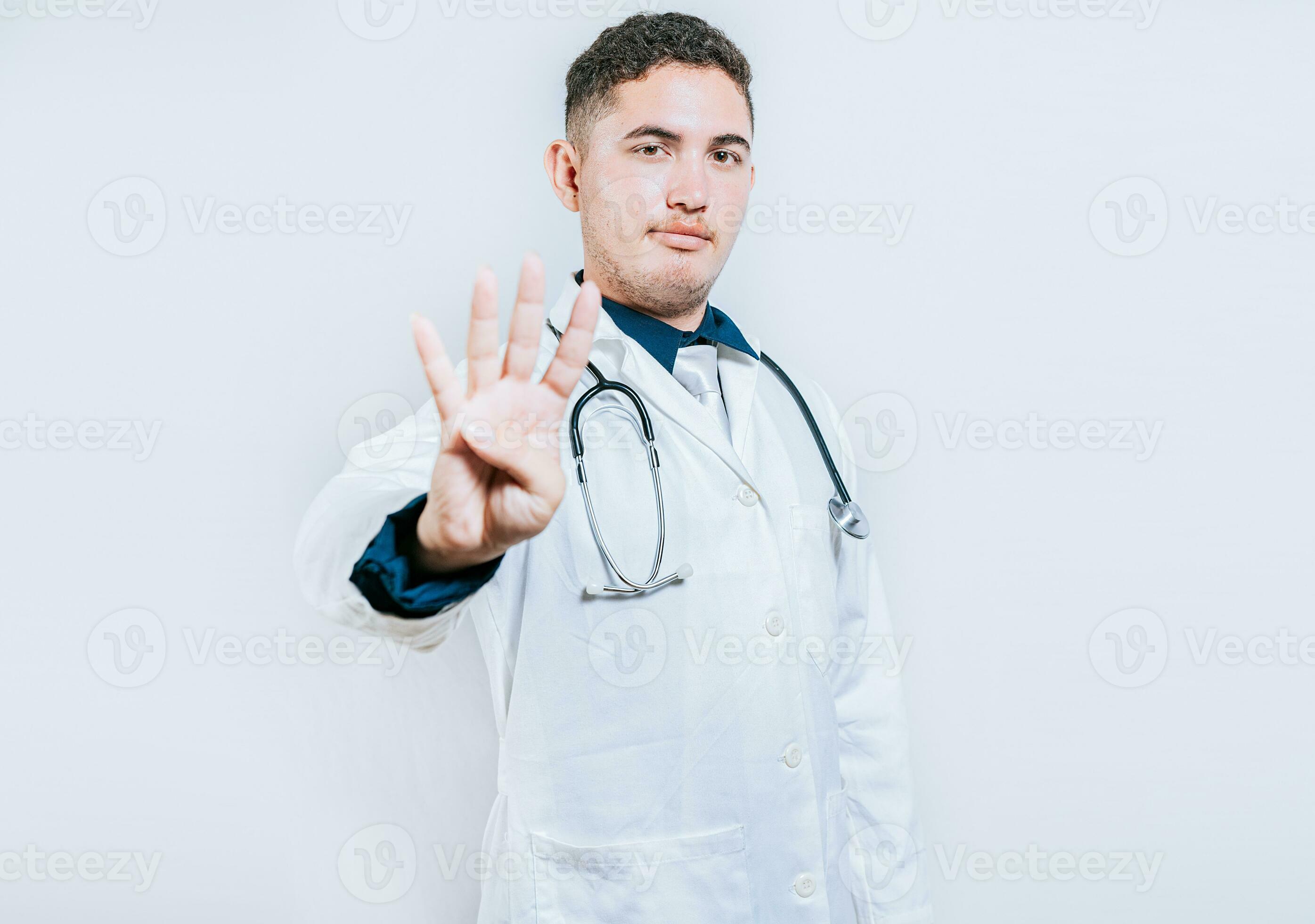 Handsome doctor counting number 4 on isolated background. Doctor ... Handsome doctor counting number 4 on isolated background. Doctor ...