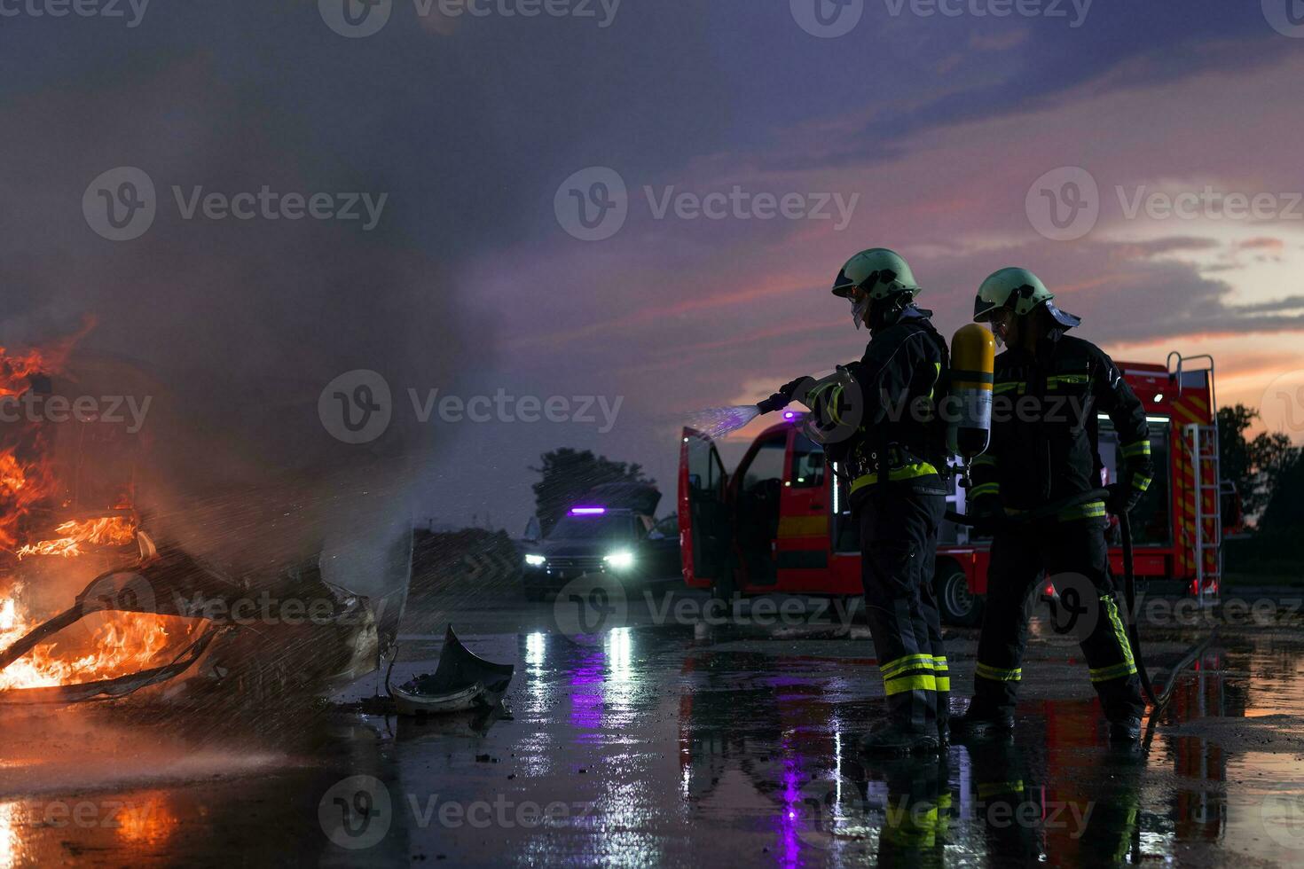 Firefighters fight the fire flame to control fire not to spreading out ...