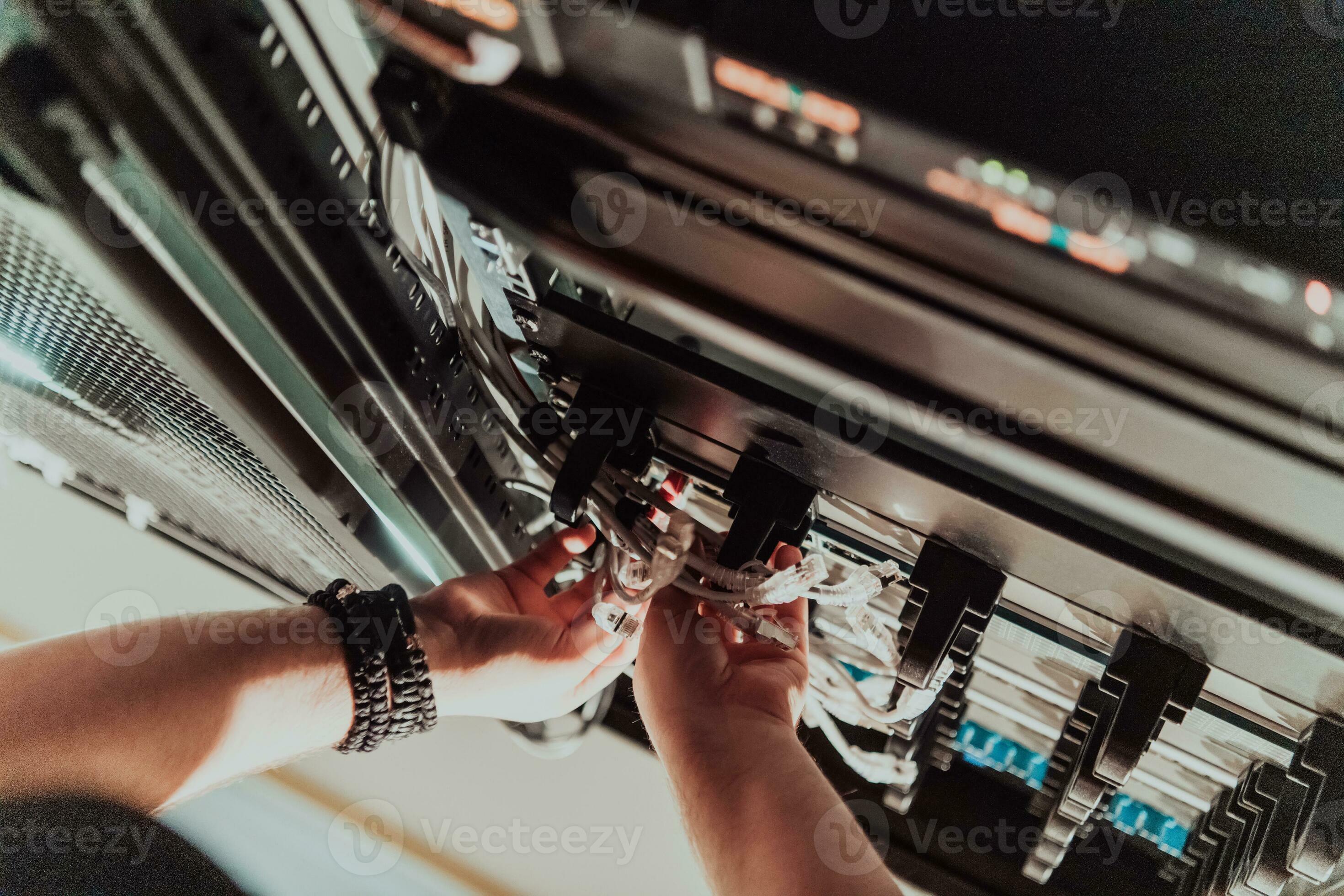 Close up of technician setting up network in server room 31029554 Stock ...