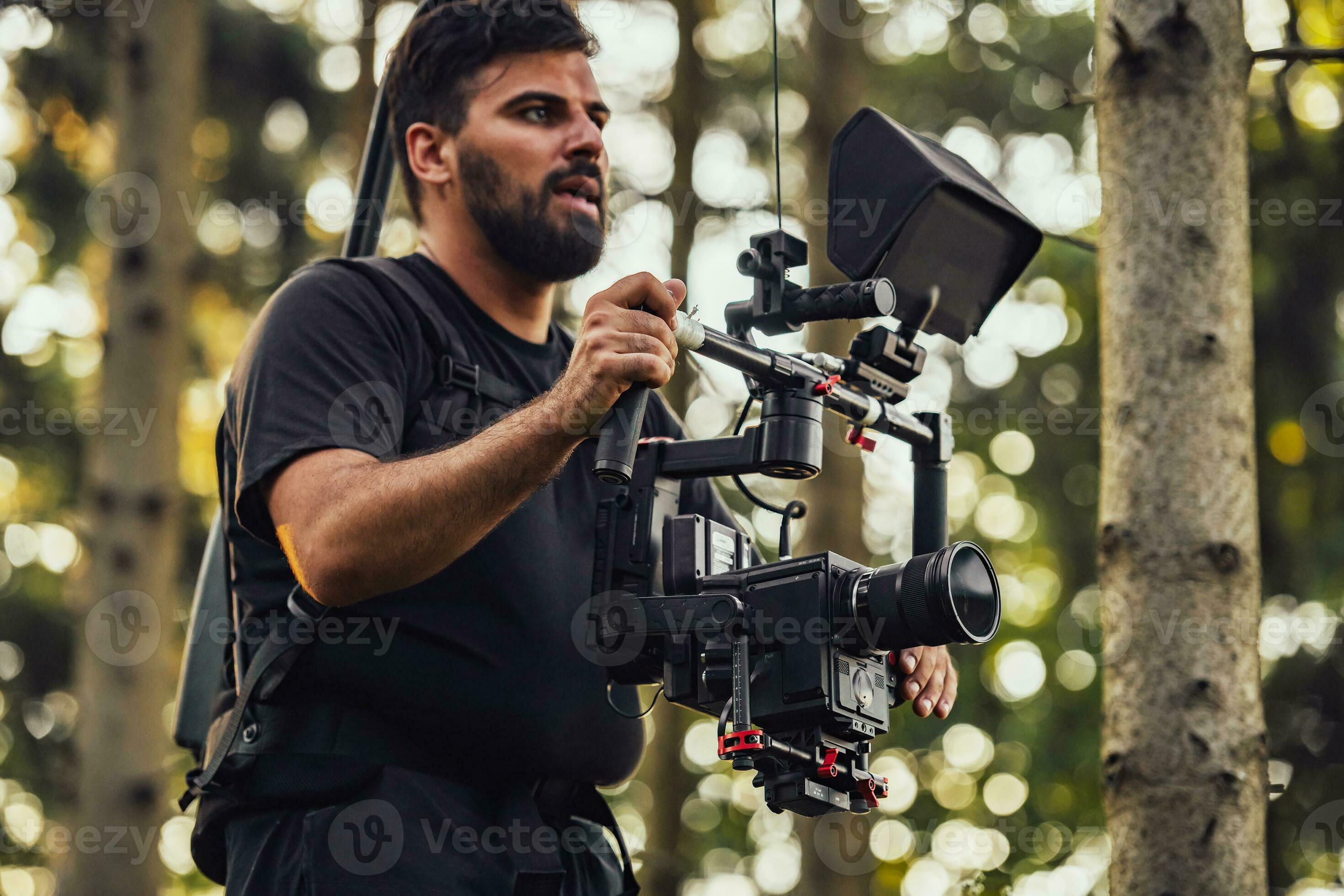 Videographer with Professional Movie Video Camera Gimbal Stabilizing ...