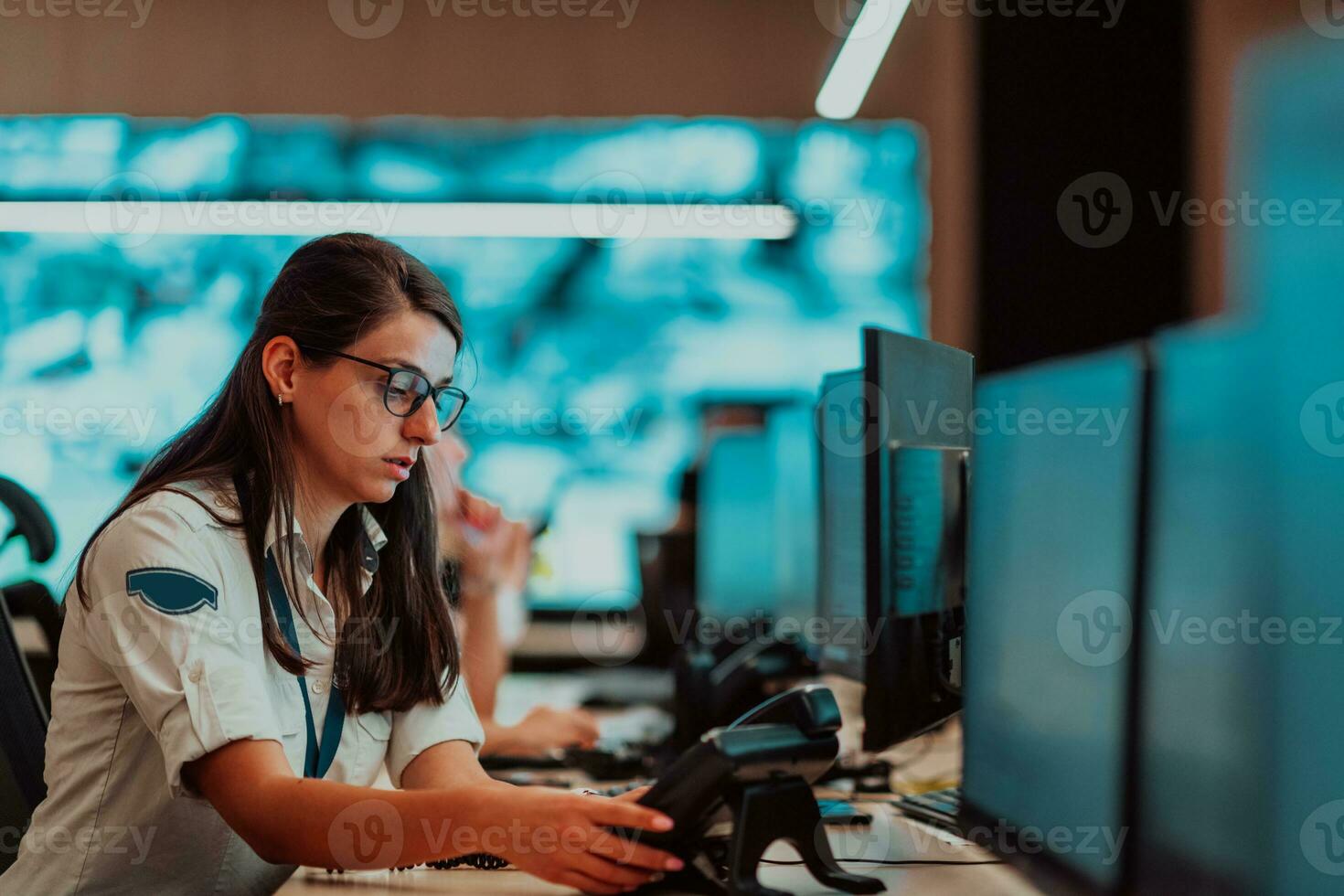 Female Security Operator Working In A Data System Control Room Offices Technical Operator