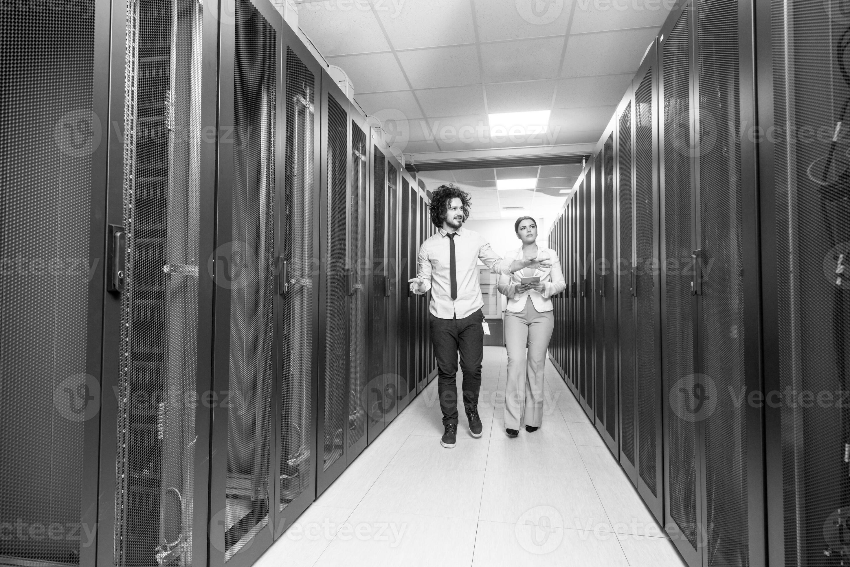 Engineer Showing Working Data Center Server Room To Female Chief