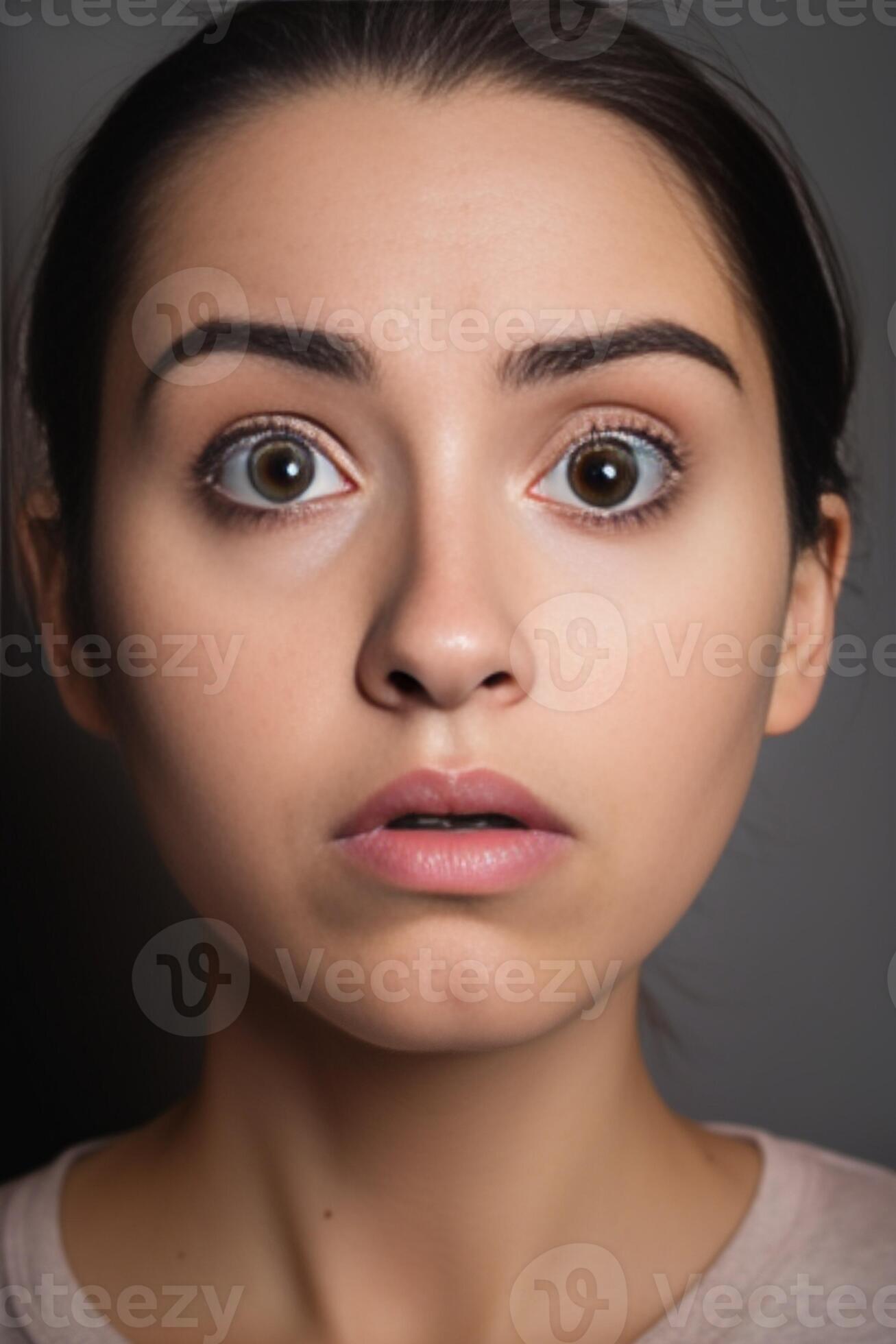 Young brunette woman looking crosseyed Closeup shot with wide angle and ...
