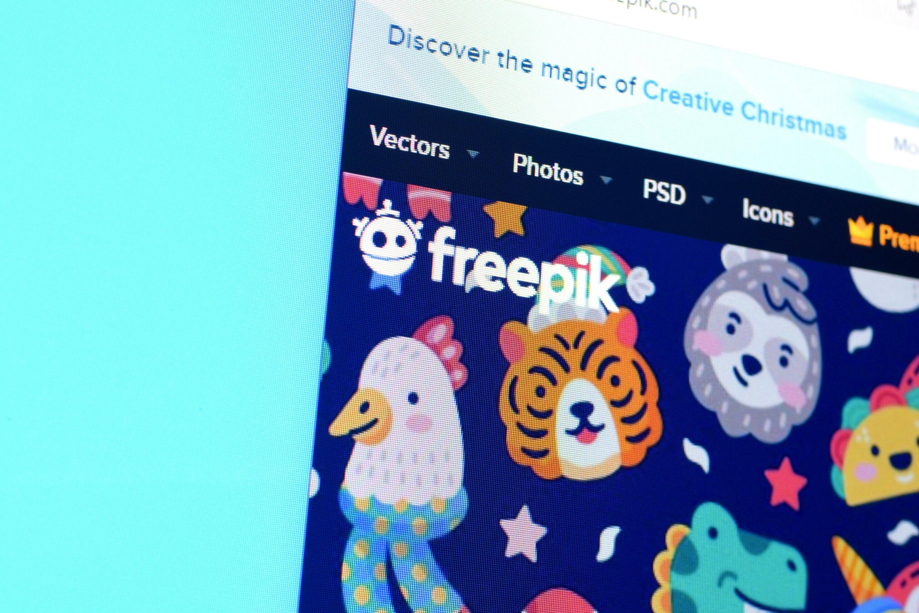 Homepage of freepik website on the display of PC, url - freepik.com ...