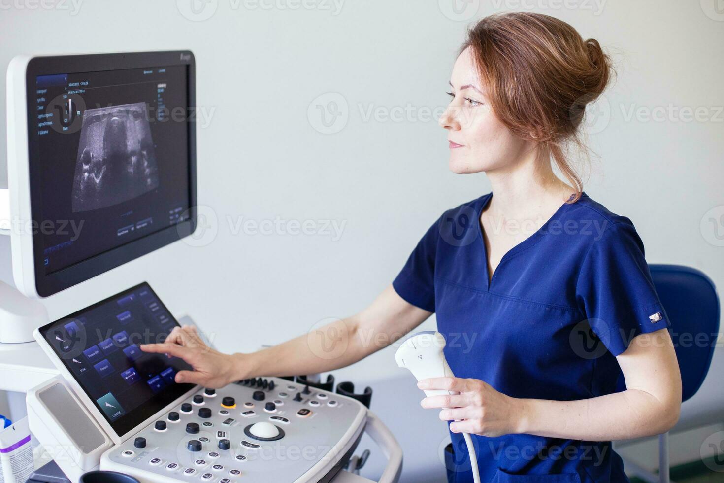 Doctor Woman Doing Ultrasound Scanning Diagnostic Of Thyroid Gland