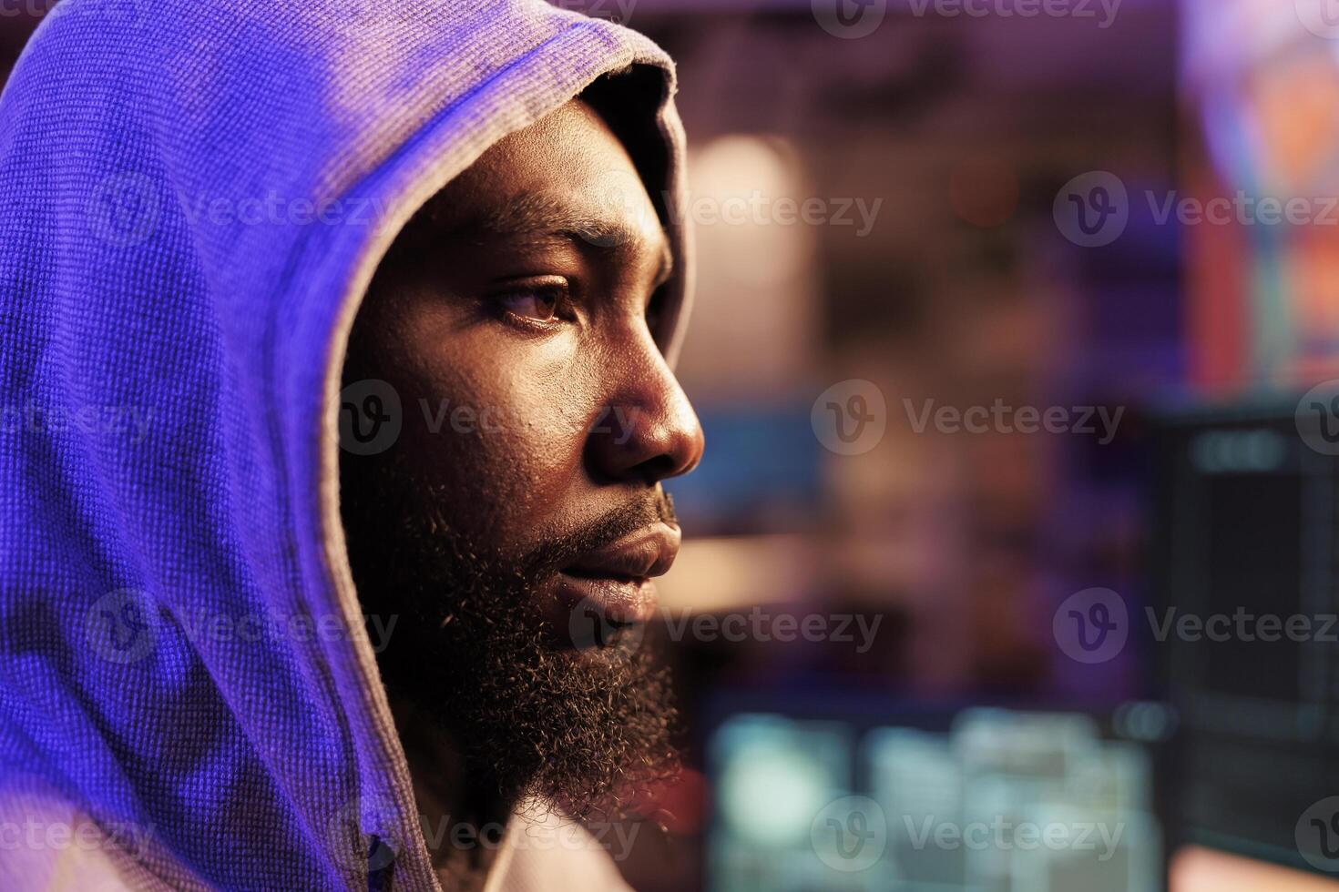 African american hacker in hood breaking into computer network system ... African american hacker in hood breaking into computer network system ...