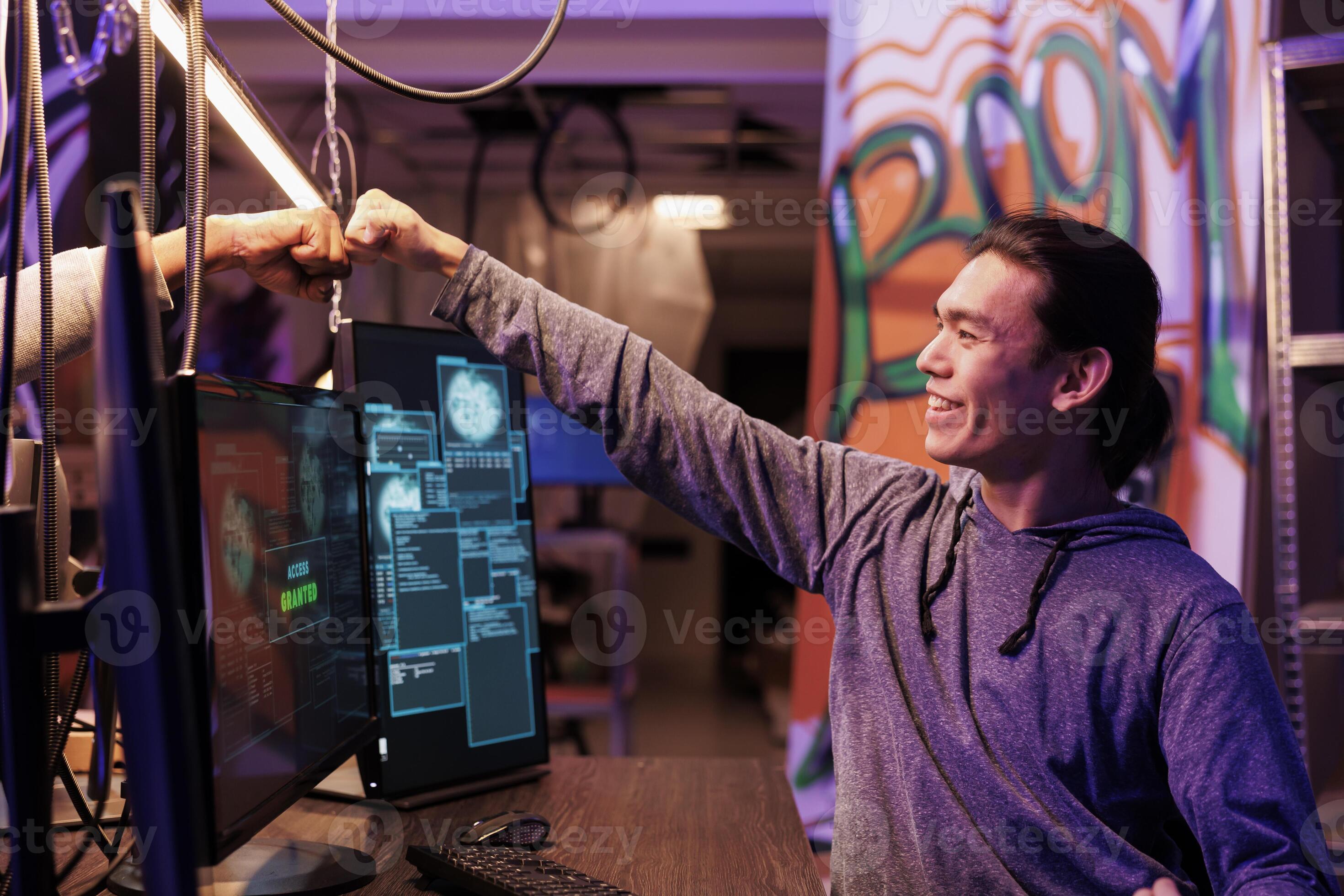Happy Hacker Bumping Fists With Crime Partner After Breaking Into