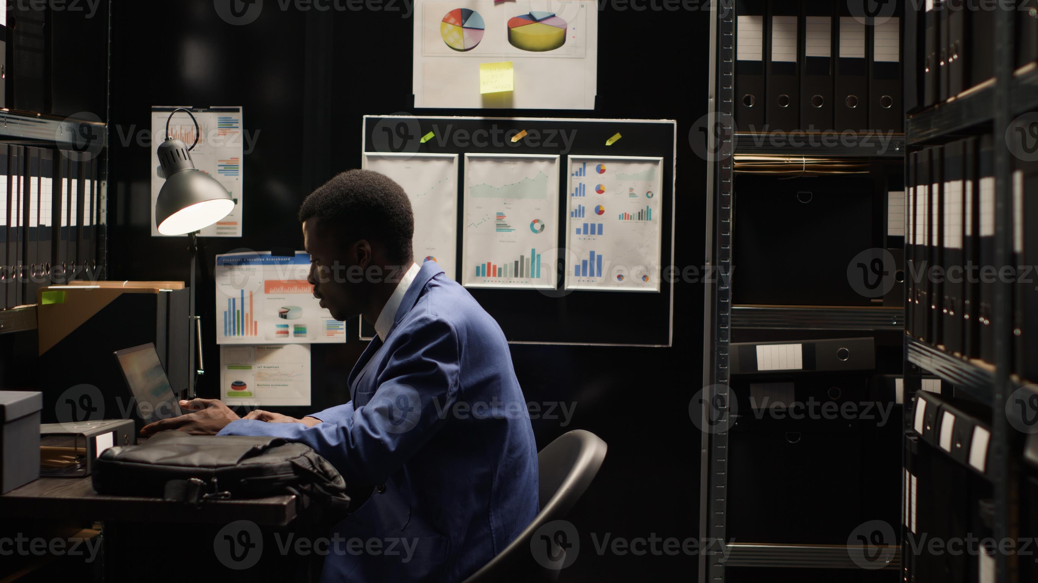 Private investigator enters office with laptop bag and begins working ... Private investigator enters office with laptop bag and begins working ...