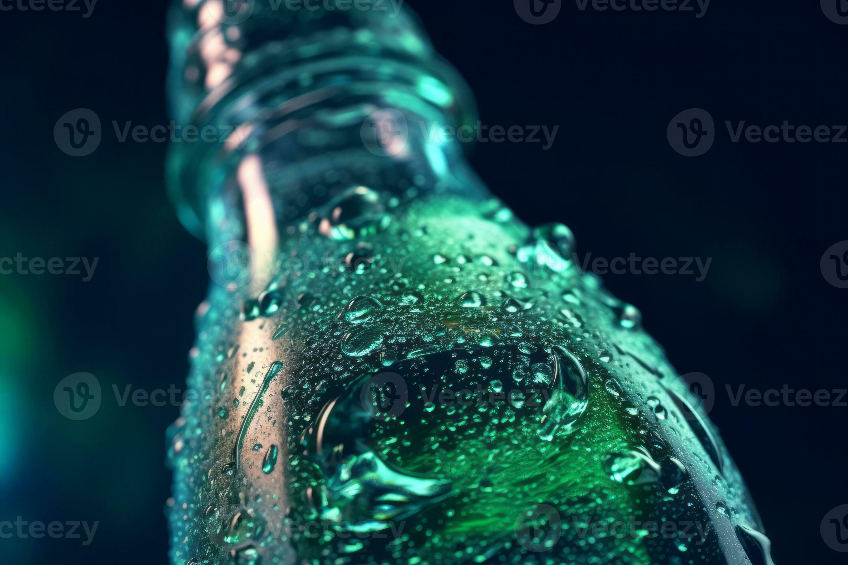 A close-up shot of condensation forming on a chilled bottle of mineral water, creating a sense ...