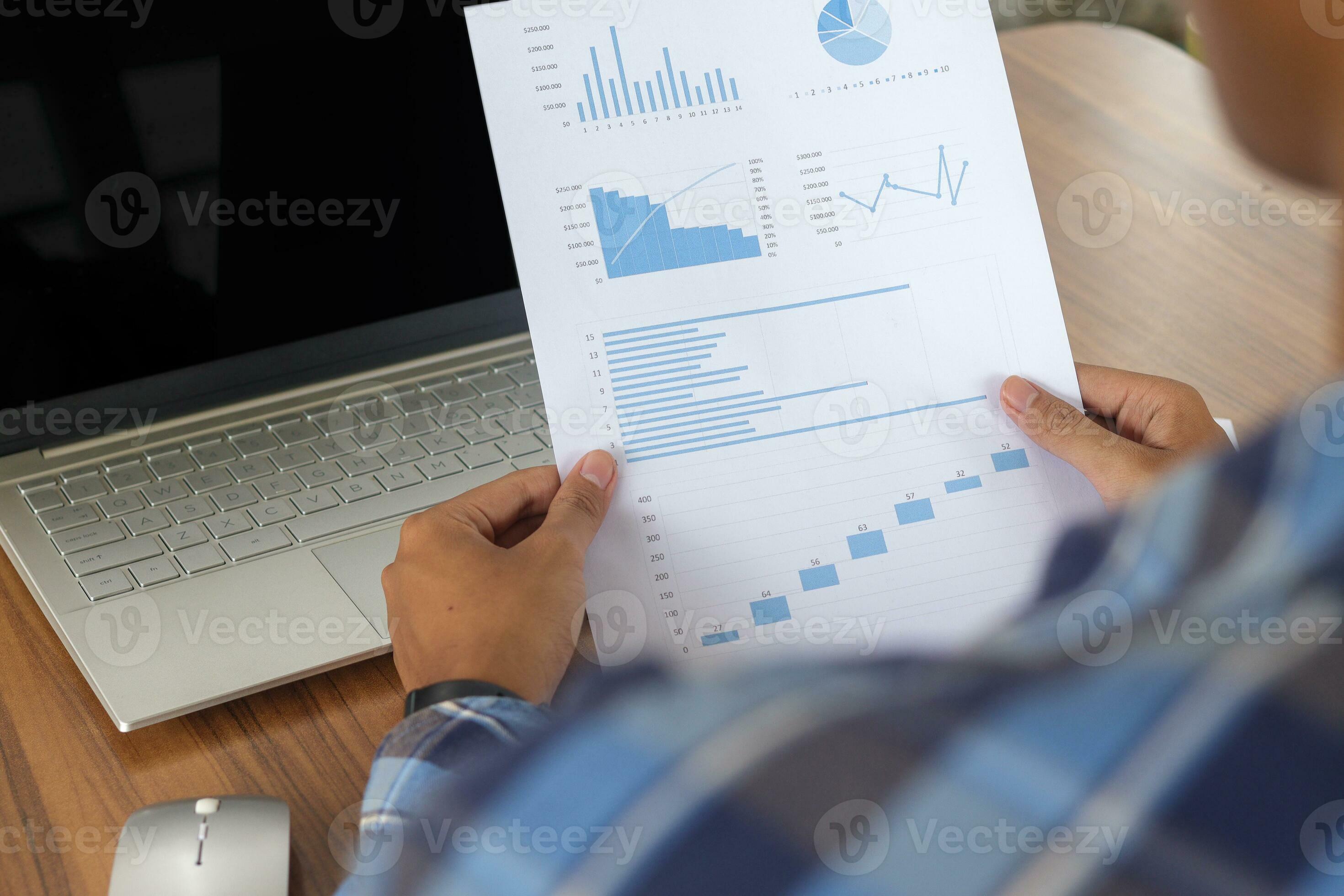 Close up of male freelance worker hand working on laptop and pointing ...