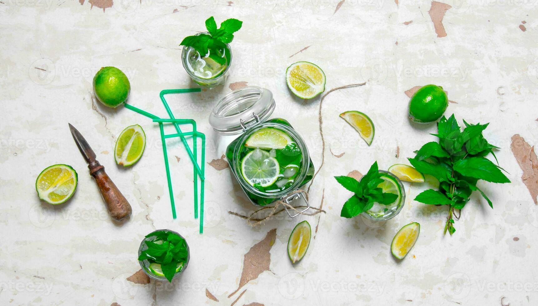 Ingredients For Making Mojitos Lime Mint Leaves Rum Citrus Knife And An Old Table 32031268