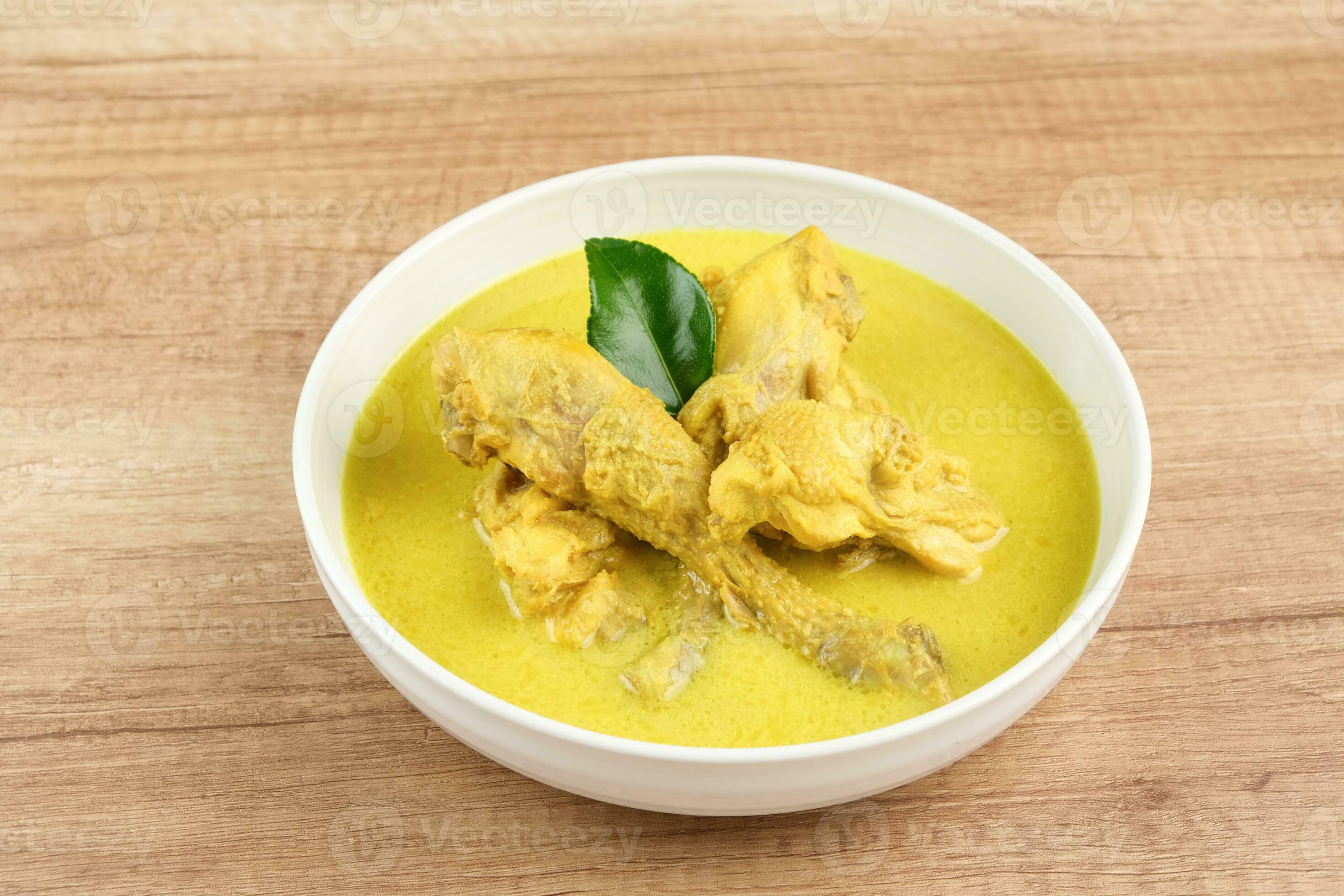 Opor Ayam, Indonesian traditional food, made from chicken cooked with coconut milk and spices ...