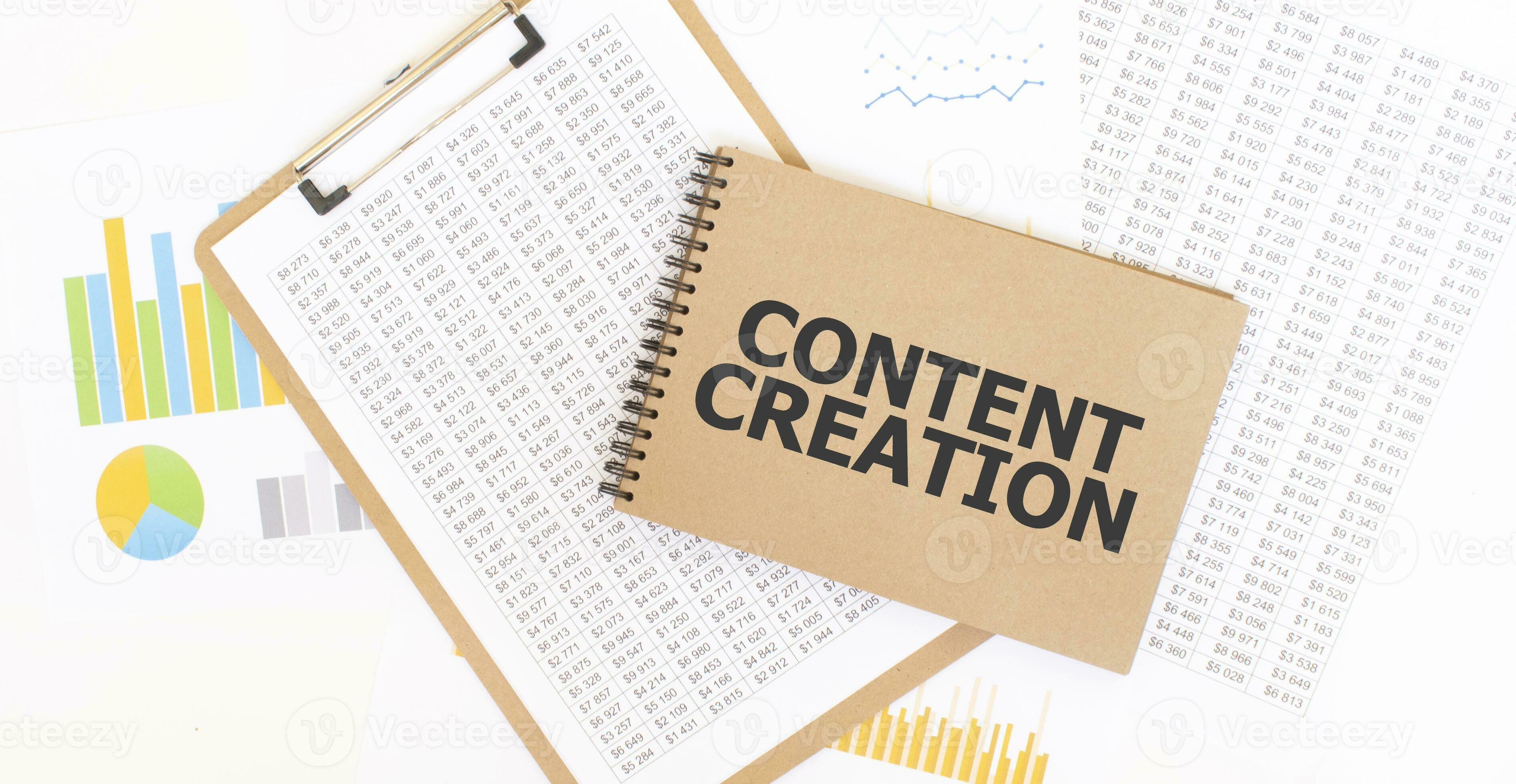 Text CONTENT CREATION on brown paper notepad on the table with diagram ...