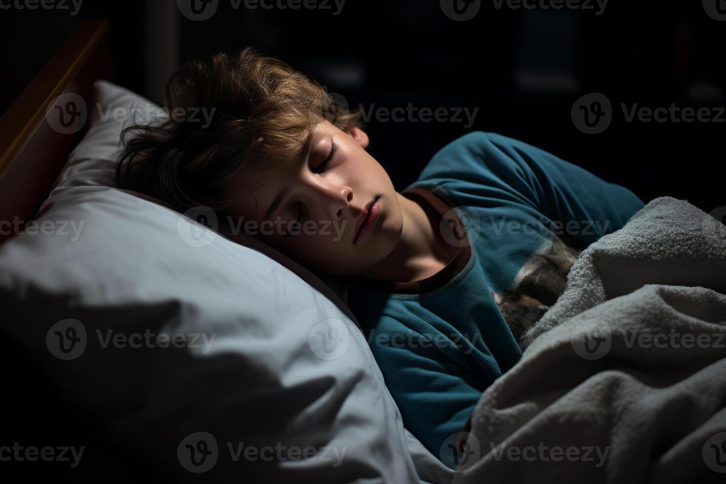 a young boy sleeping in bed at night generative ai 32110691 Stock Photo at Vecteezy
