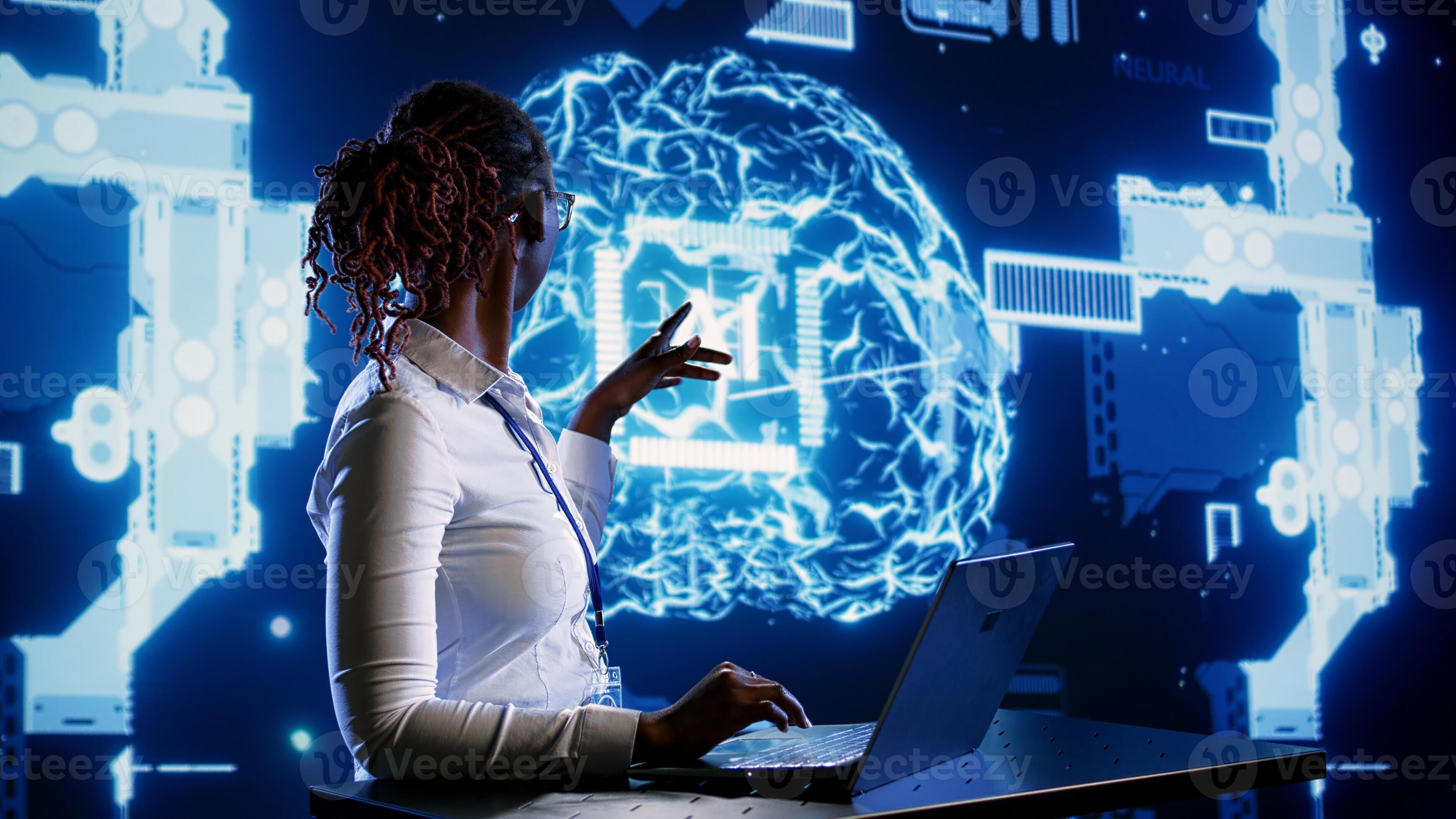 Certified expert using laptop to maintenance artificial intelligence ...