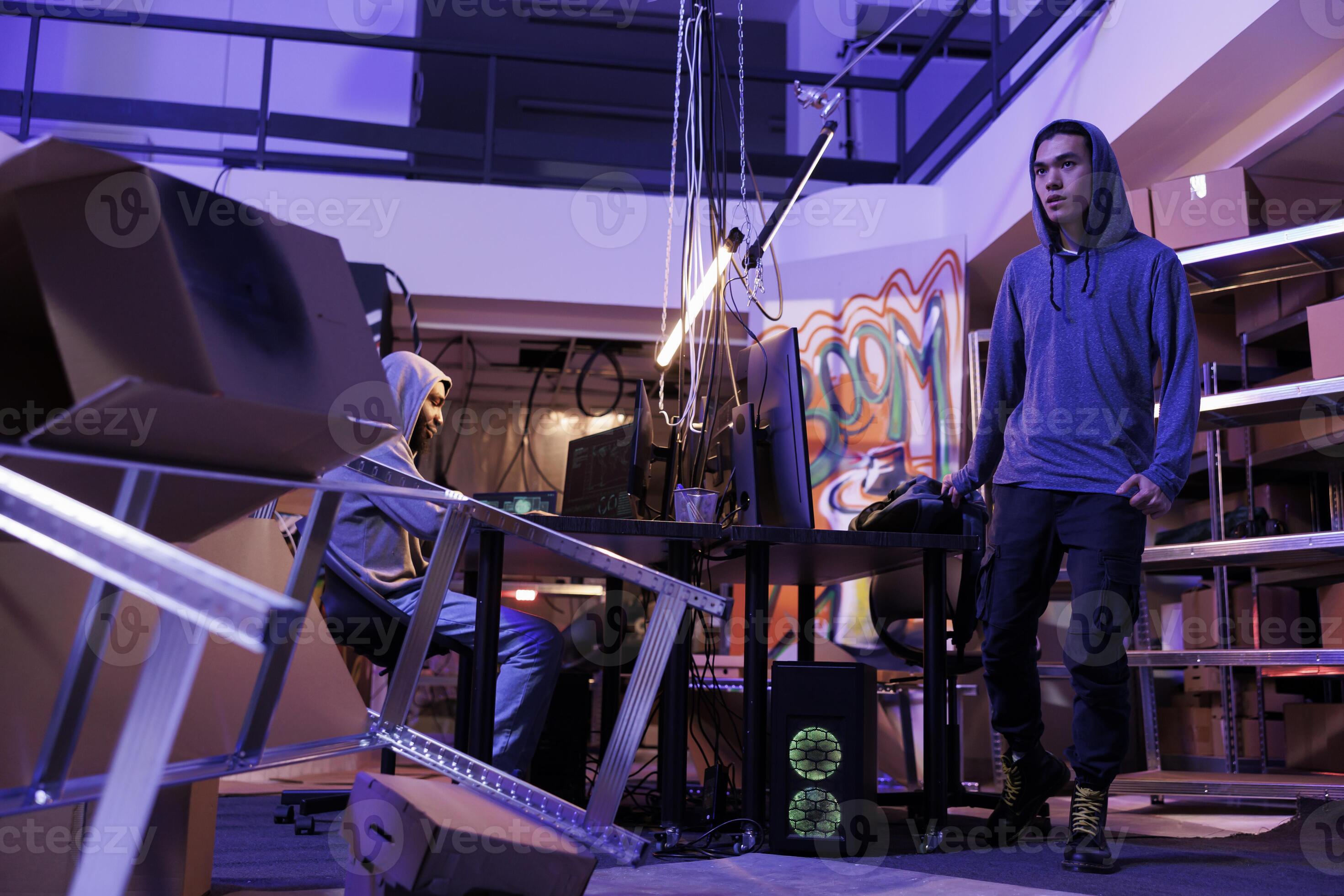 Hacker Leaving Abandoned Warehouse After Hacking Network System Asian