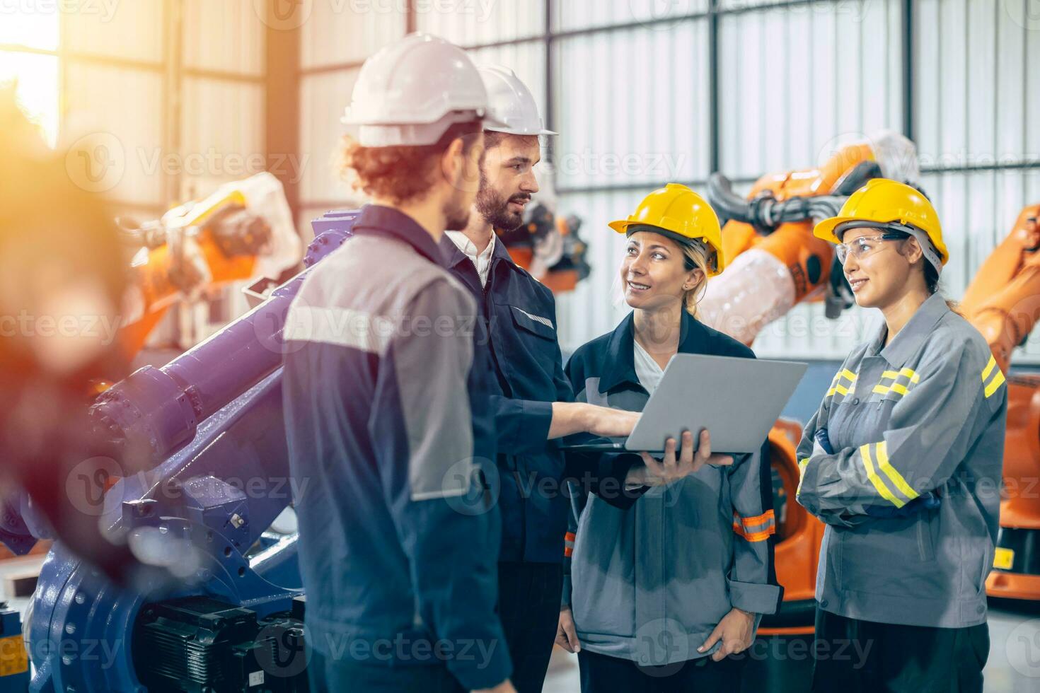 Group of engineer team stand talking together. Industry engineering teamwork people discussion ...