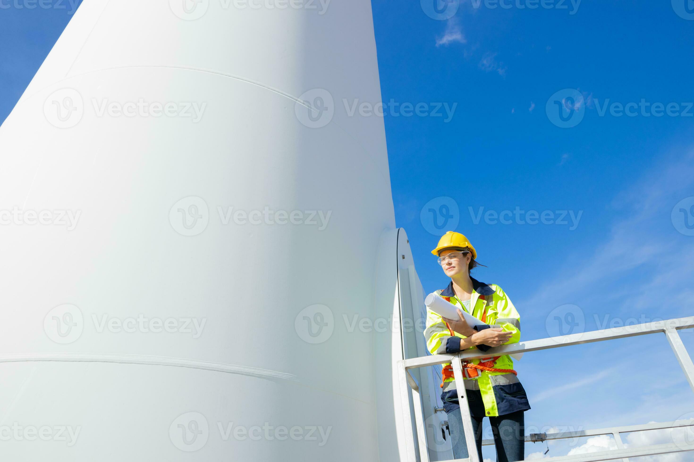 Engineer smart professional techician woman working service wind turbine sustainable eco power ...