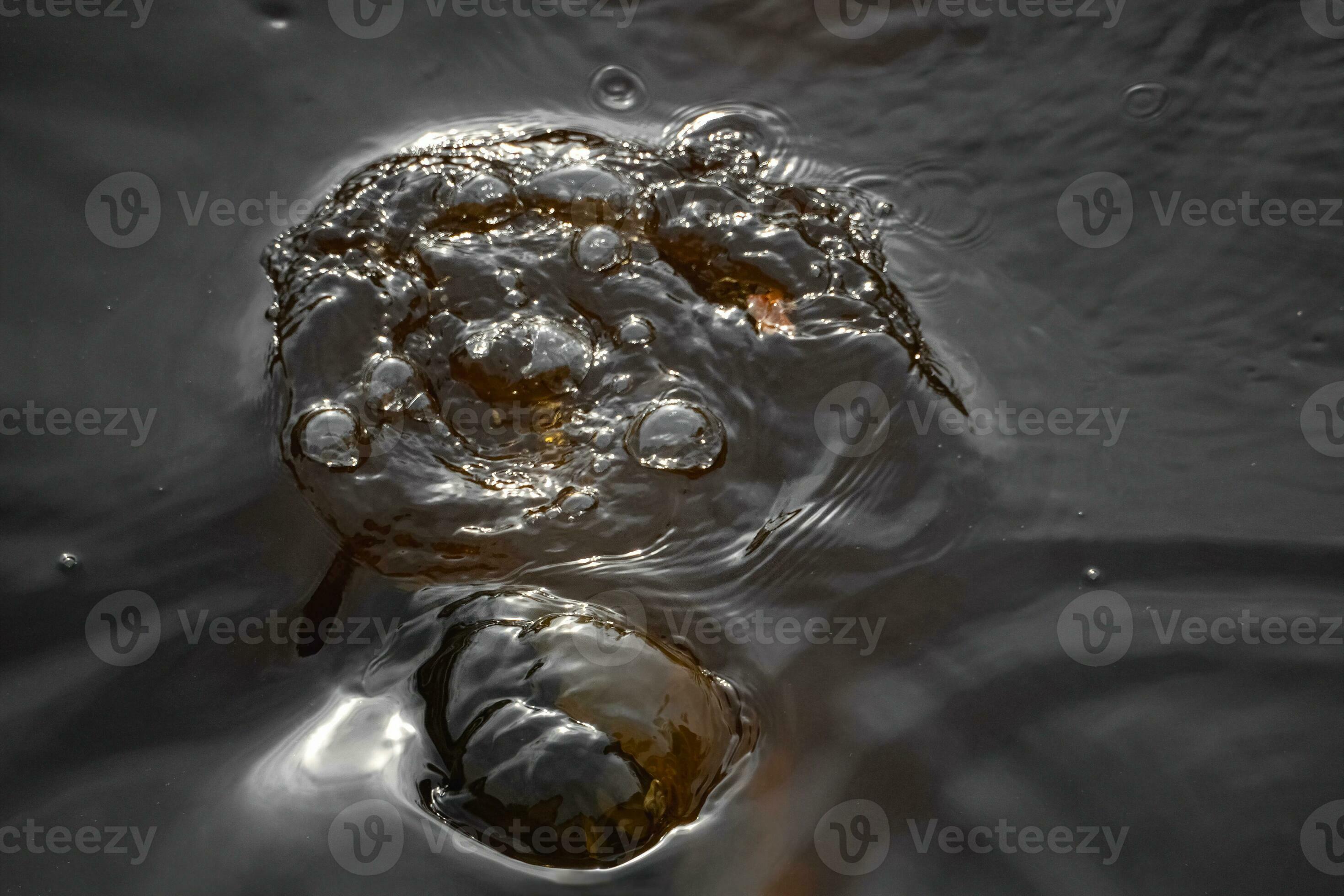 Gas bubbles caused by the accumulation and spoilage of sewage from industrial wastewater ...