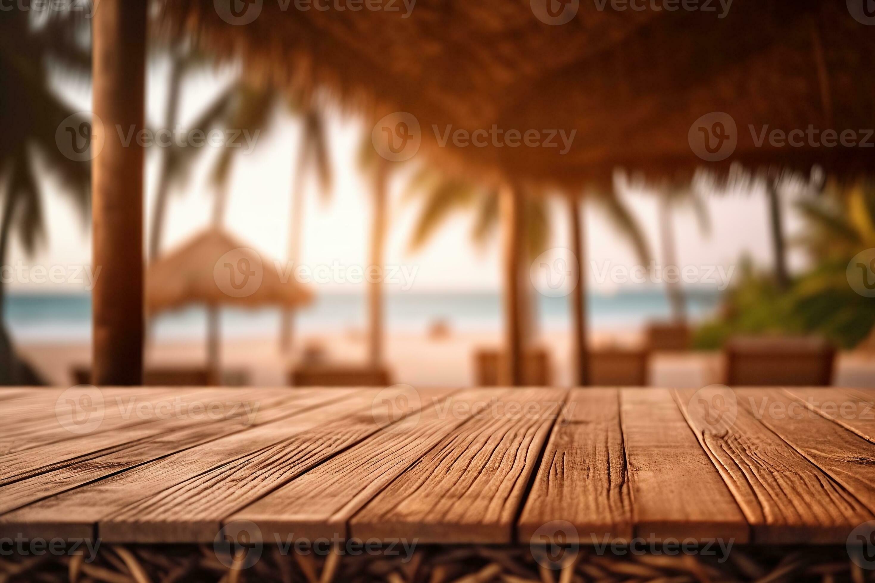 A photo of an empty wooden table with a tiki beach bar blurred background Generative AI 33055948 ...