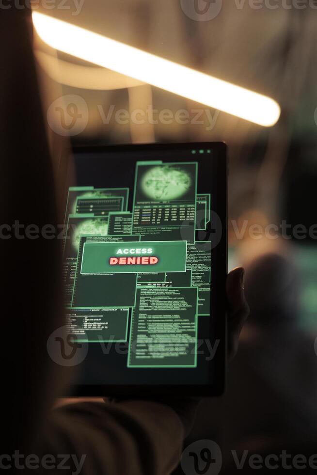 Access denied message on digital tablet, hacker failed database hacking, unsuccessful password ...