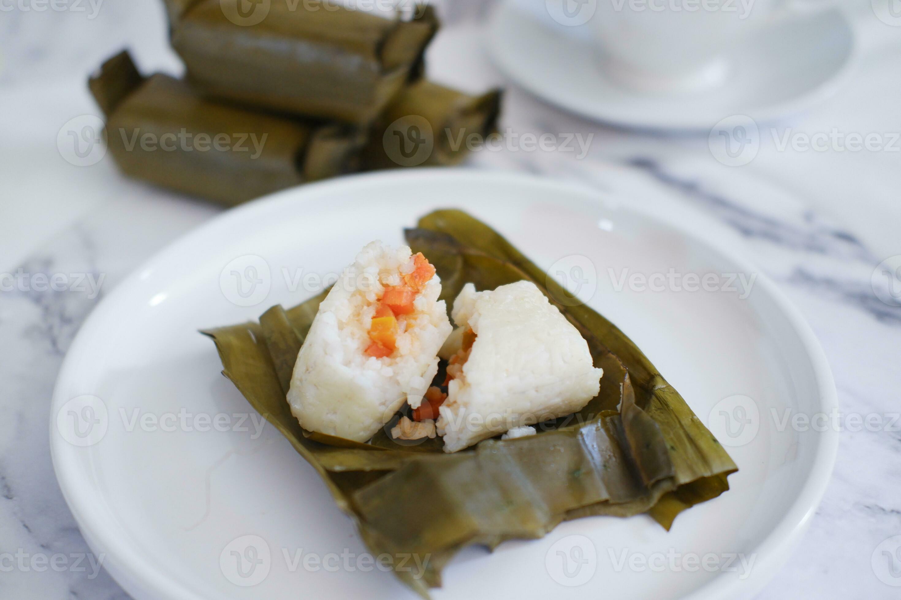Arem-arem, a traditional food made from rice filled with vegetables, chicken, meat or tempeh ...