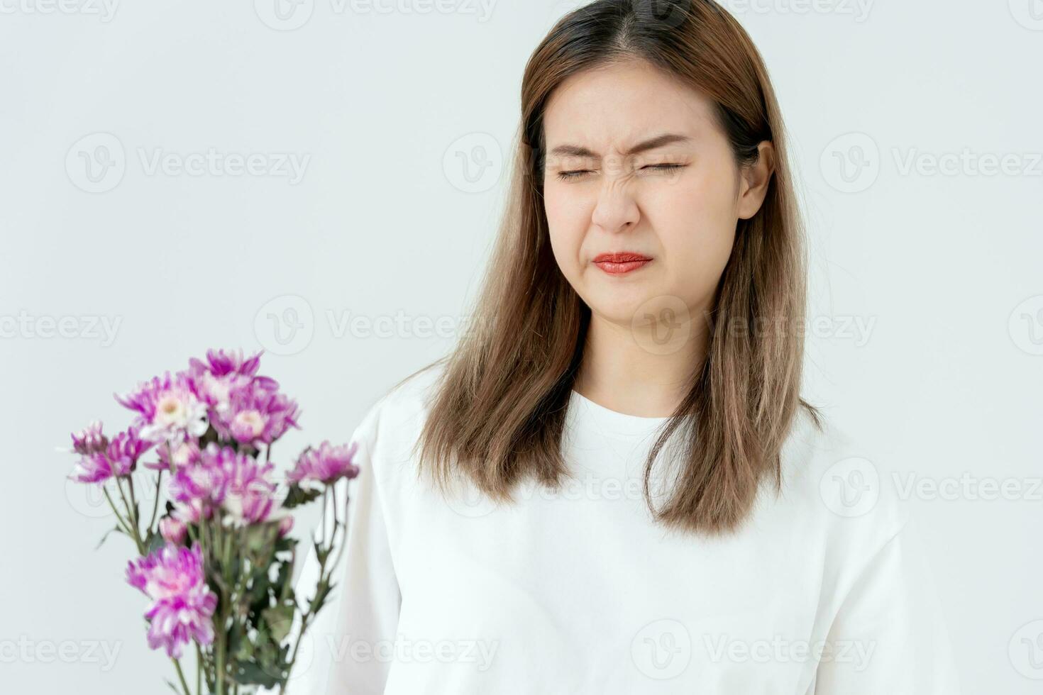 Pollen Allergies, asian young woman sneezing in a handkerchief or blowing in a wipe, allergic to ...