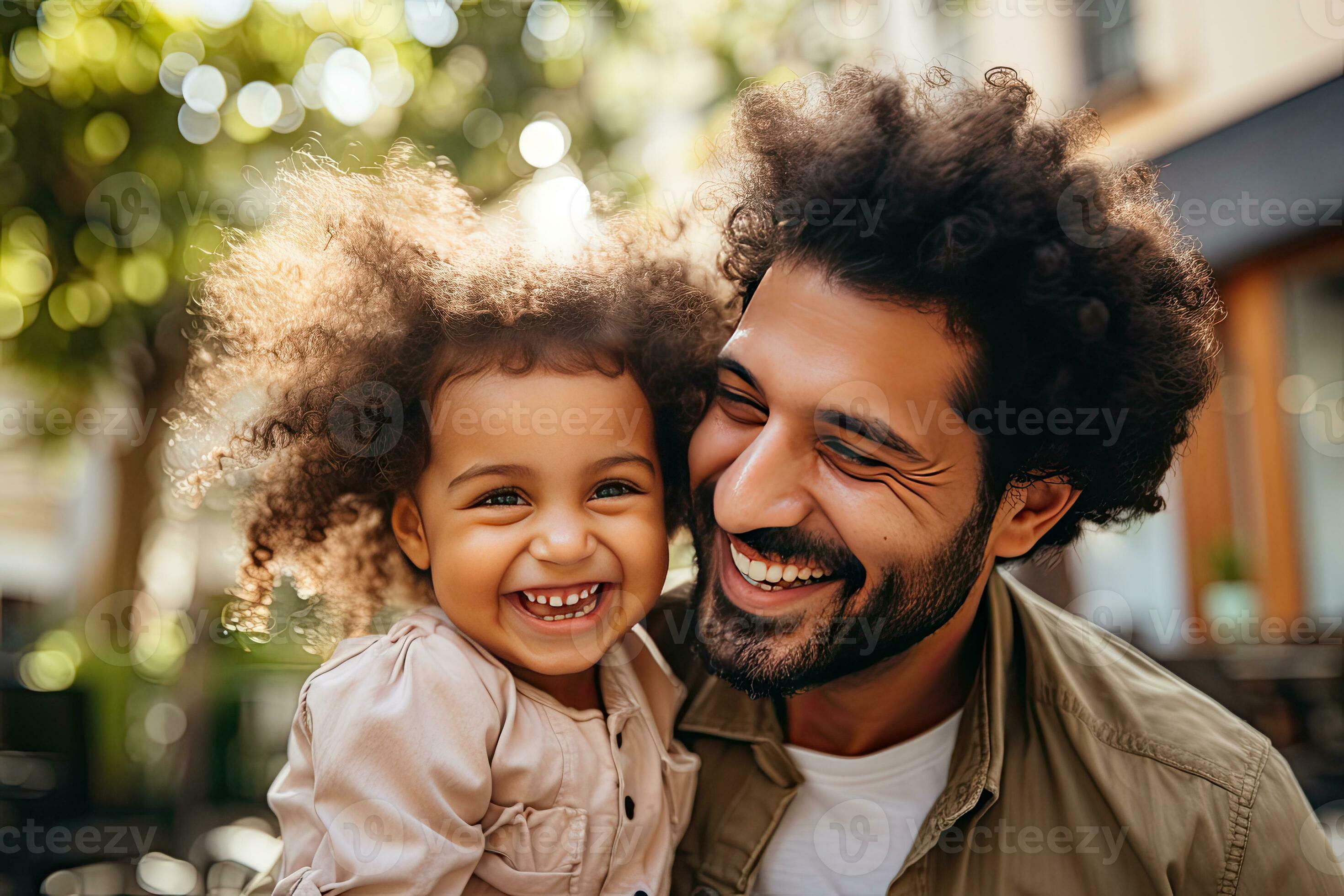 Happy Father And Daughter Hugging And Smiling While Spending Time
