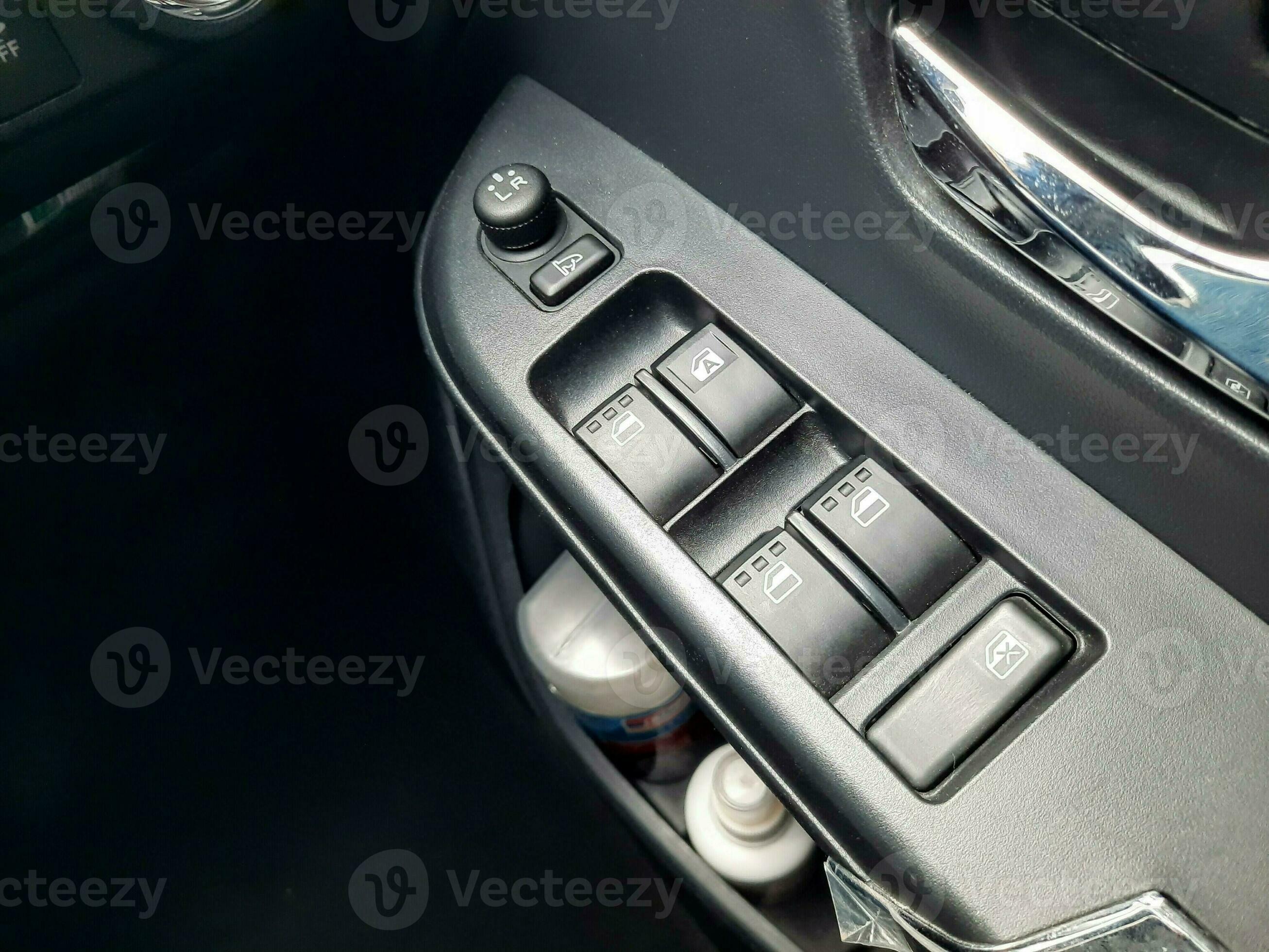 Window control buttons in modern car. Car window control panel. Modern car window switch. Door ...