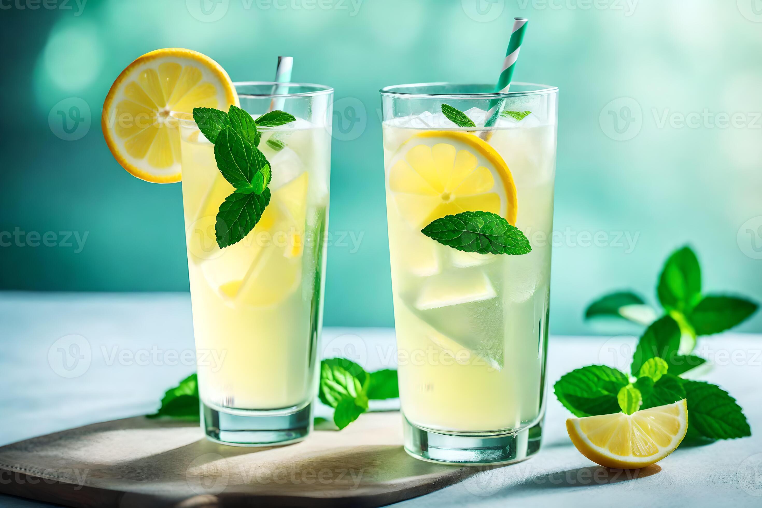 two glasses of lemonade with mint leaves and lemons. AI-Generated 33800975 Stock Photo at Vecteezy