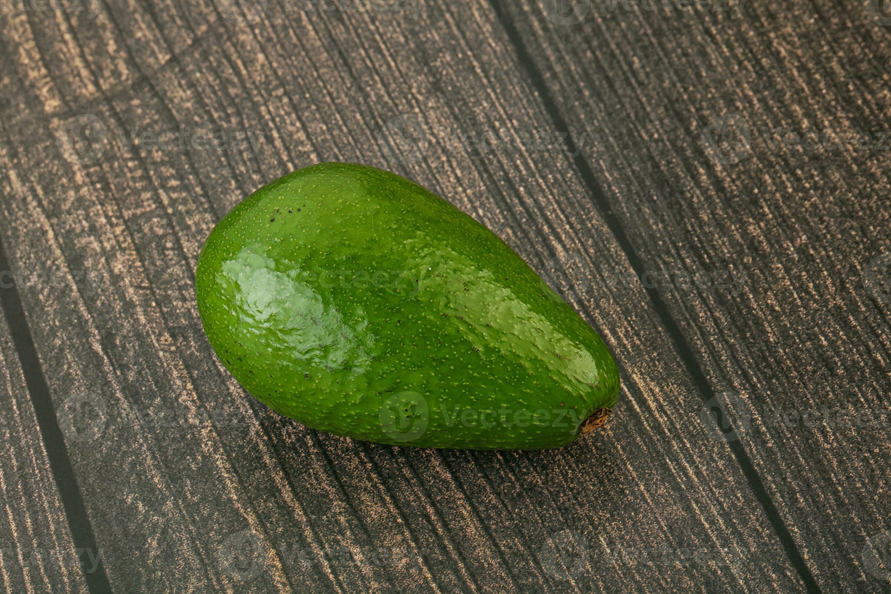 Ripe green avocado over background 34065887 Stock Photo at Vecteezy