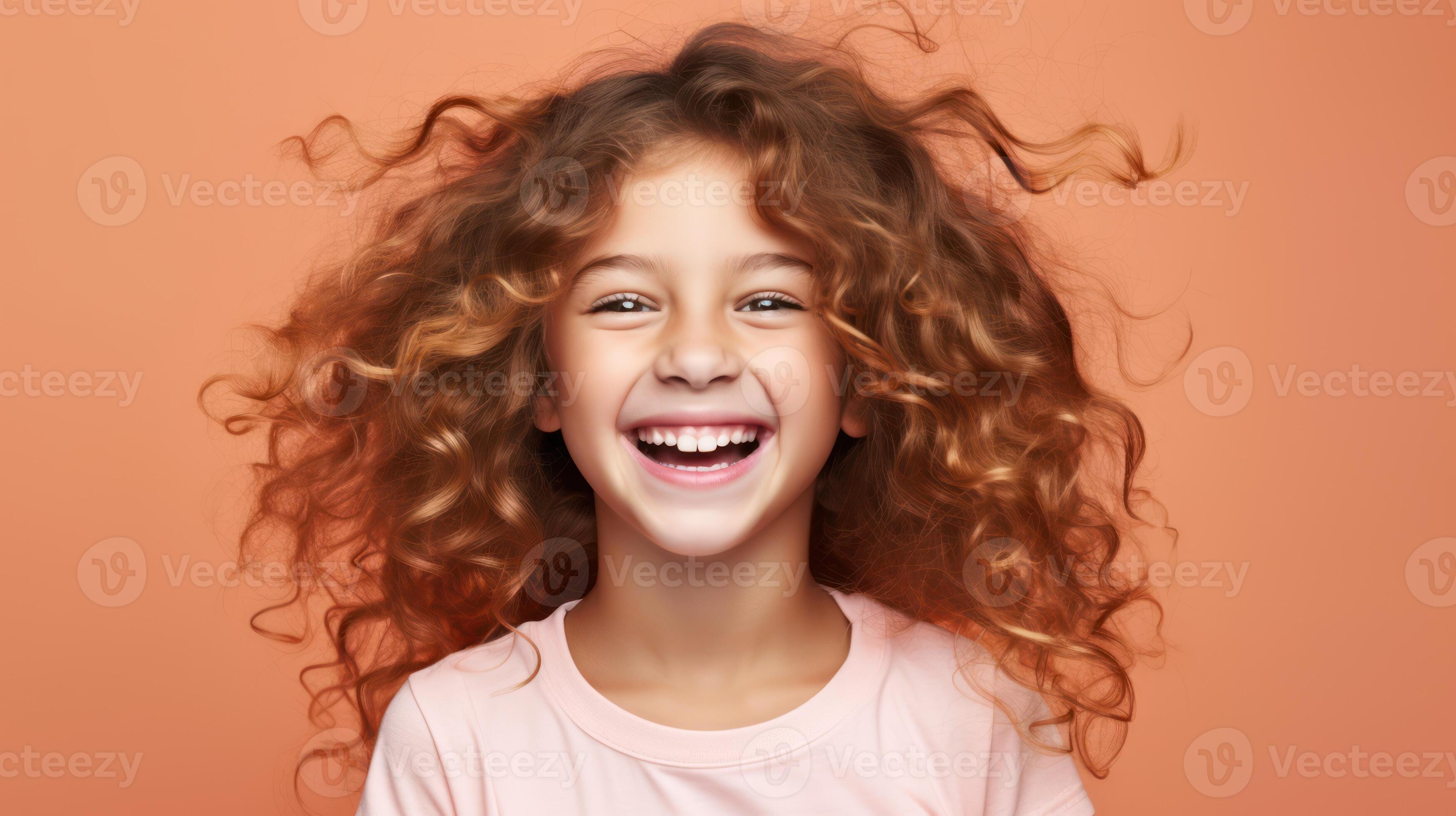 Beautiful little girl with long curly hair. Portrait of a happy child ...