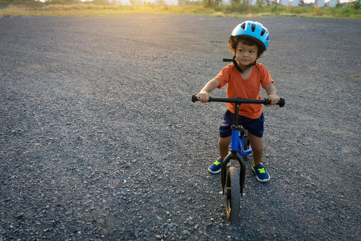 Asian kid first day play balance bike. 34709028 Stock Photo at Vecteezy