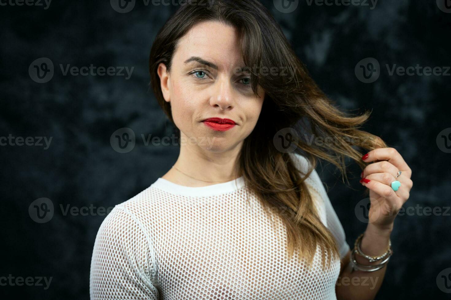 Portrait Of Beautiful Woman Wearing White T Shirt On Black Background