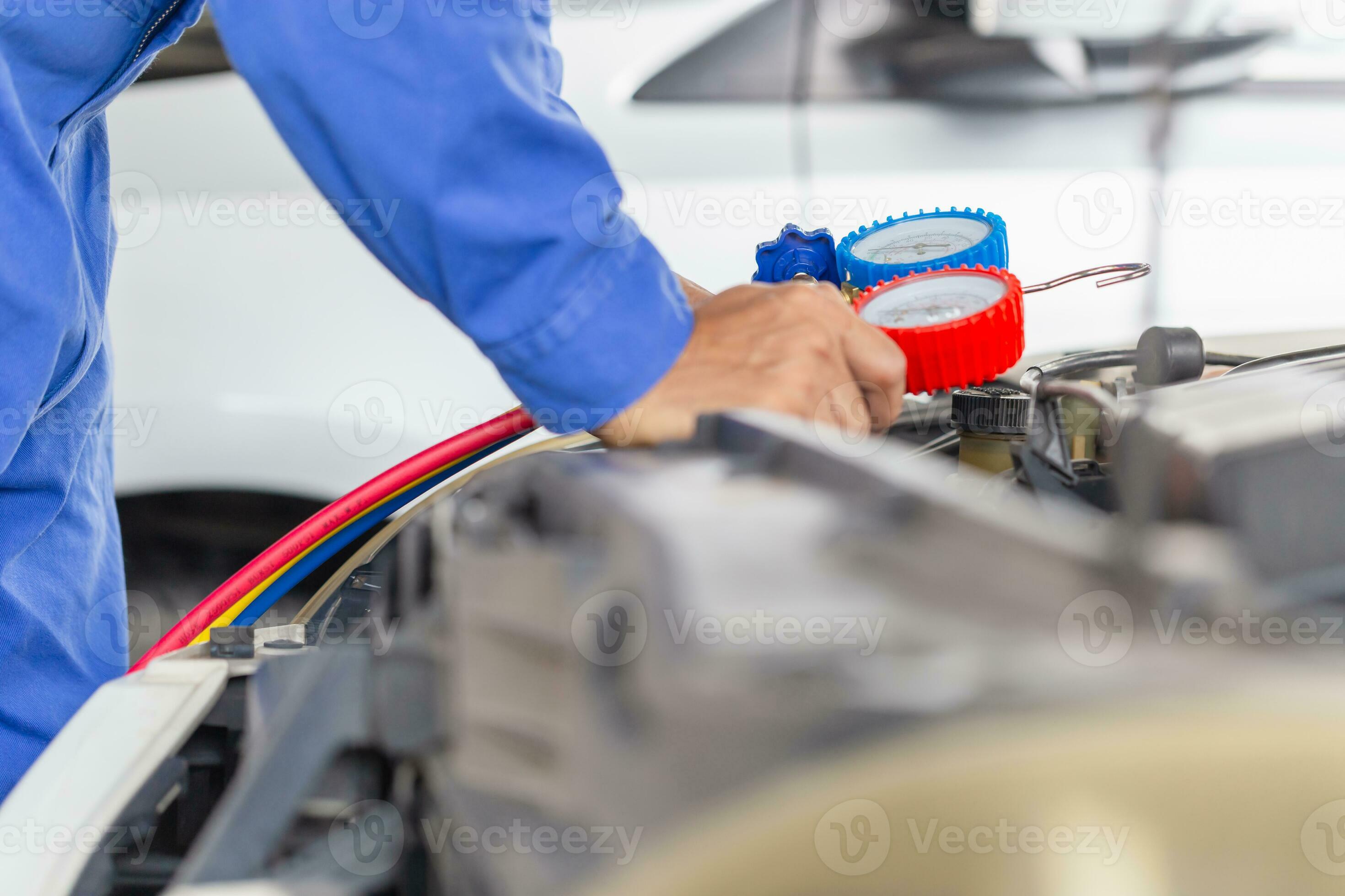 Repairman holding monitor tool to check and fixed car air conditioner system, Technician check ...