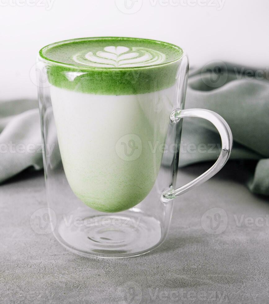 Glass of hot matcha green tea latte with tulip pattern 34754901 Stock Photo at Vecteezy