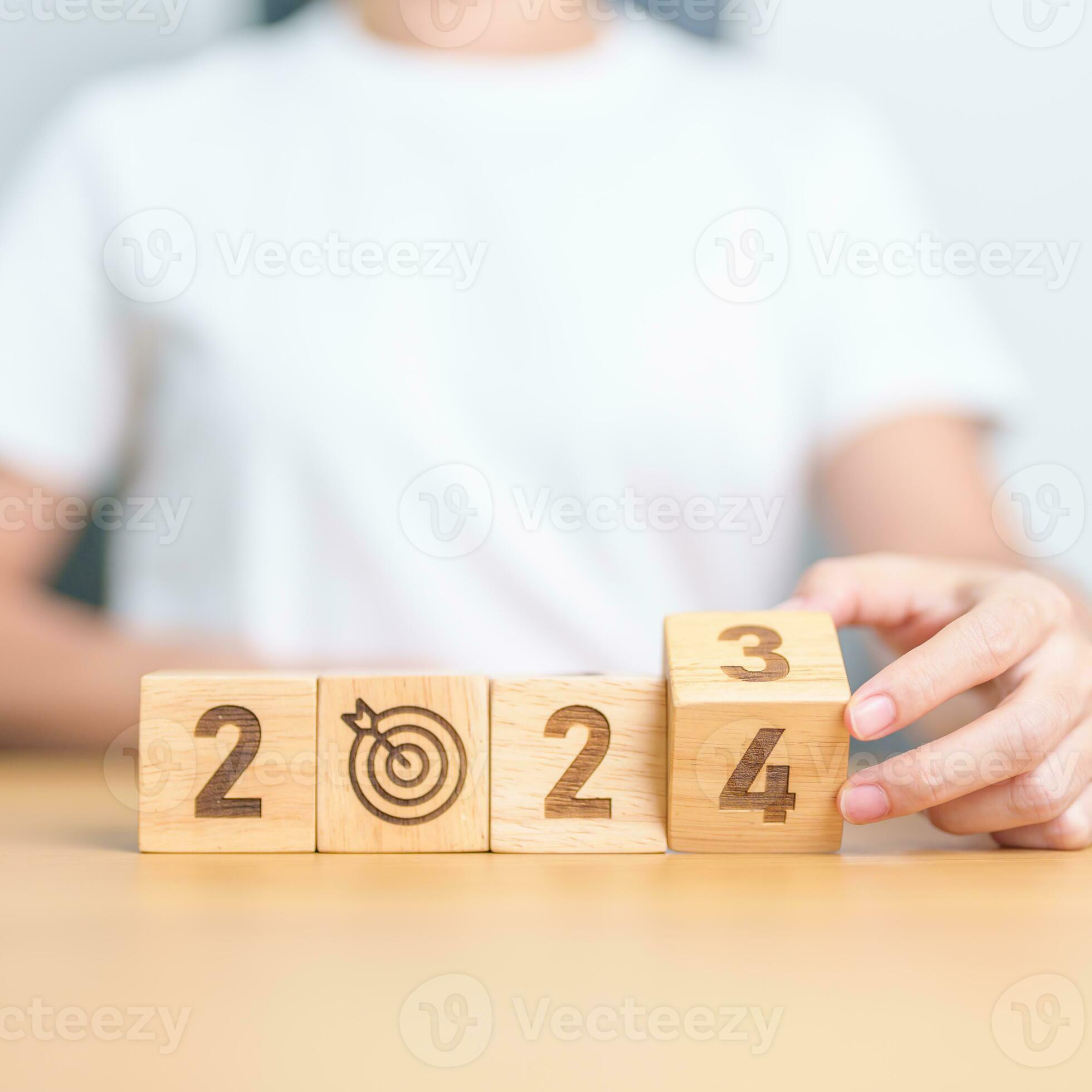 2023 year change to 2024 year block with dartboard icon. Goal, Target, Resolution, strategy ...