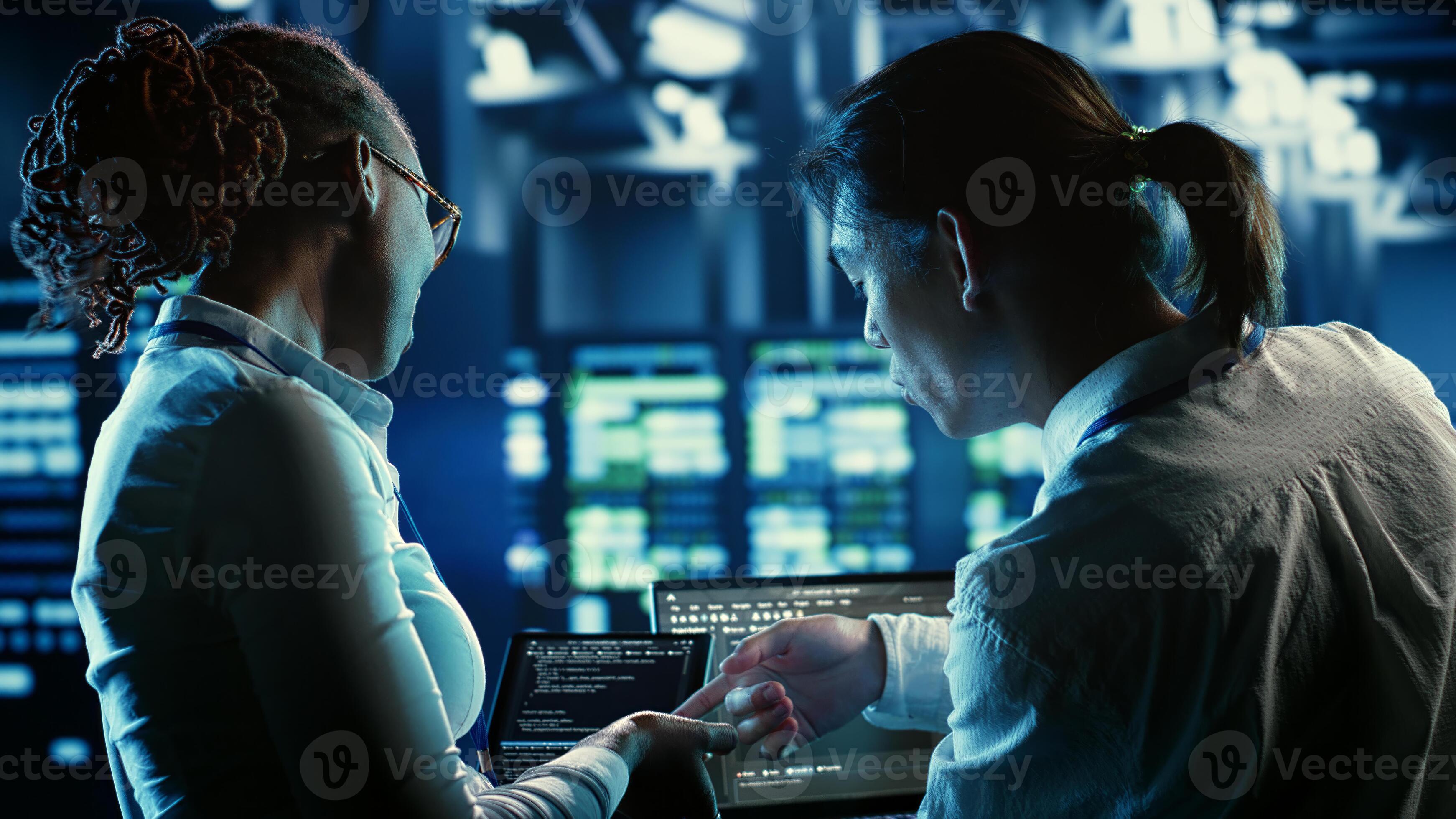 Colleagues Programming In Server Farm Housing Advanced Infrastructure Storing Massive Datasets