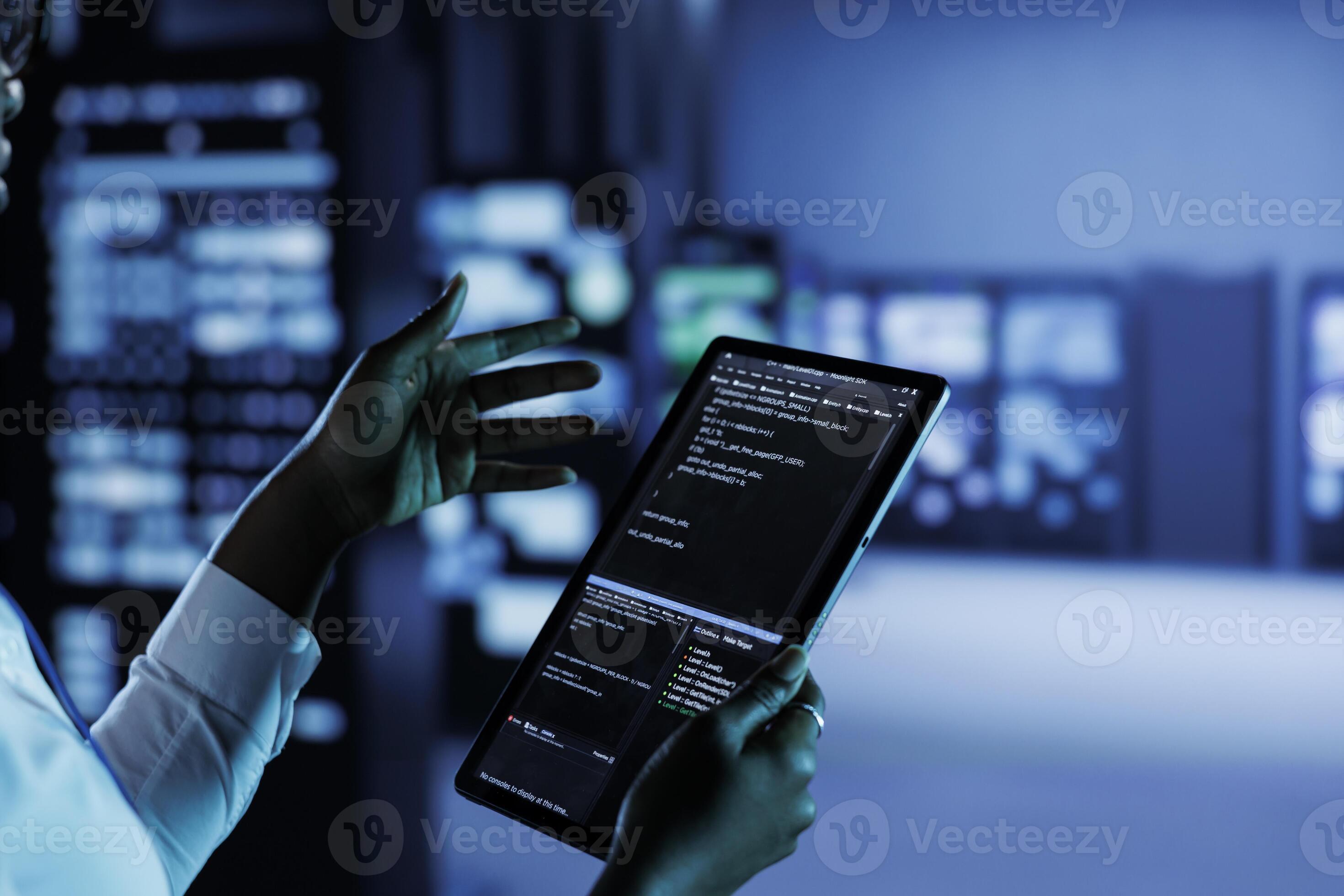 Close up of employee running code and programming on laptop, troubleshooting and upgrading high ...