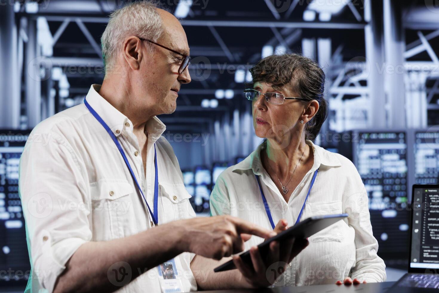 Licensed Admins Updating Server Racks Writing Intricate Binary Code Scripts On Tablet And