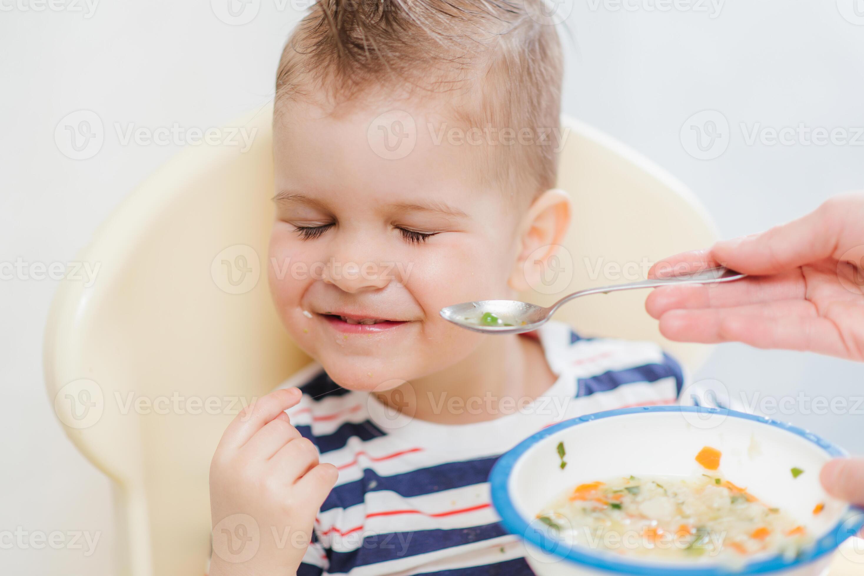 Mom Feeds The Baby And He Turns Away And Does Not Want To Eat 35044438 mom-feeds-the-baby-and-he-turns-away-and-does-not-want-to-eat-35044438