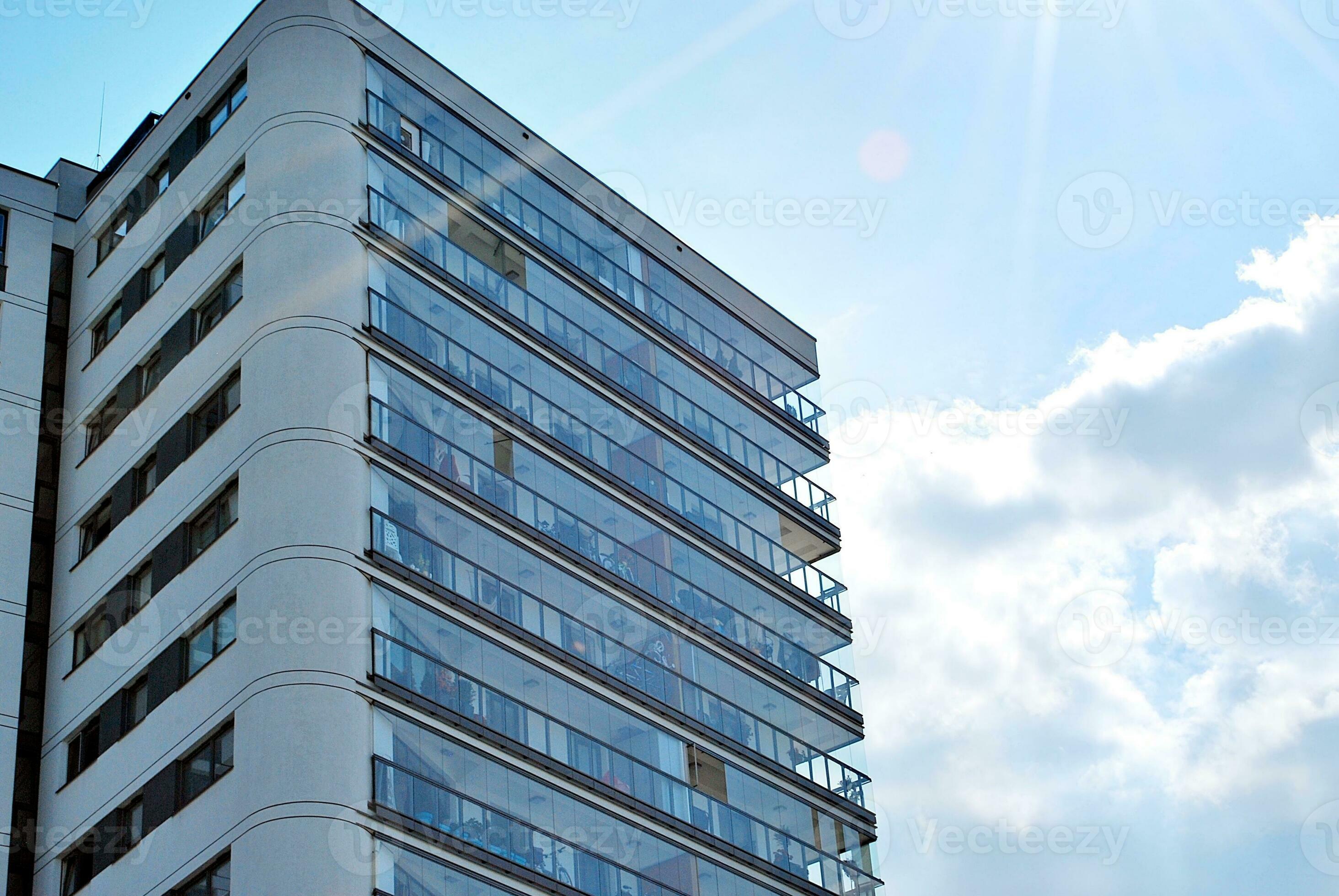 Brand new apartment building on sunny day. Modern residential ... Brand new apartment building on sunny day. Modern residential ...
