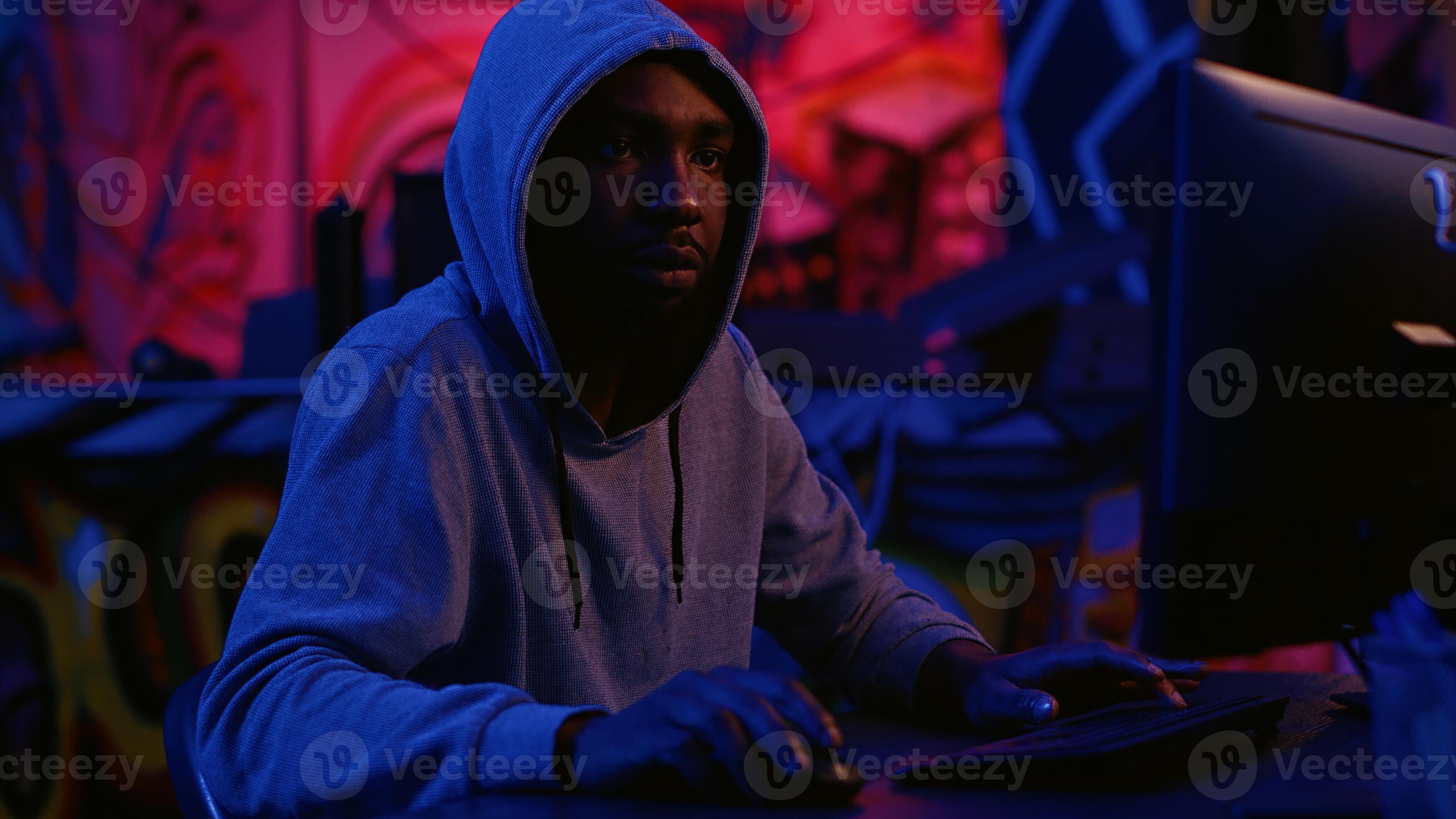 Hacker In Secret Dark Room Writing Lines Of Code On Computer