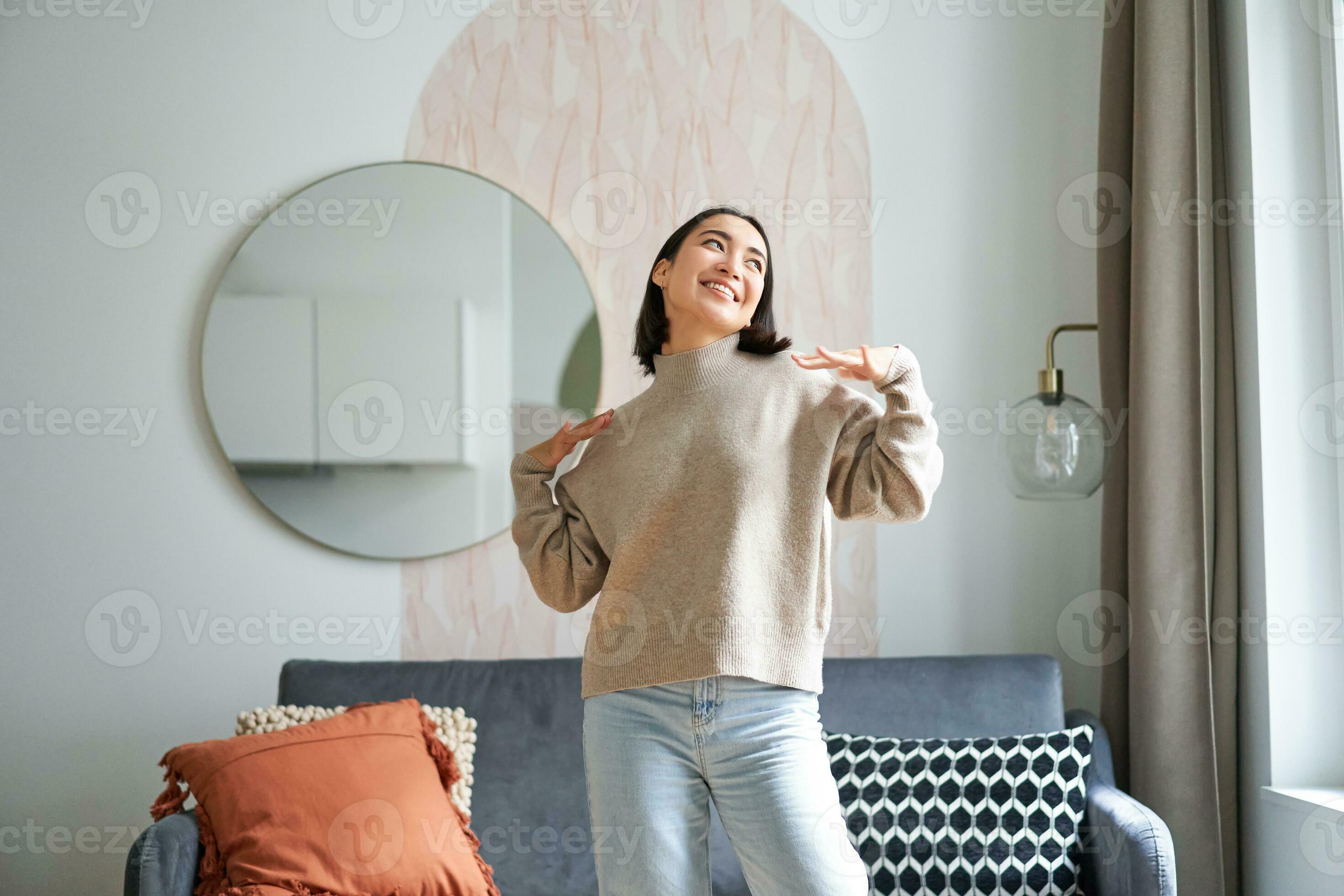 People and emotions. Joyful teen girl dancing in her room, feeling ...