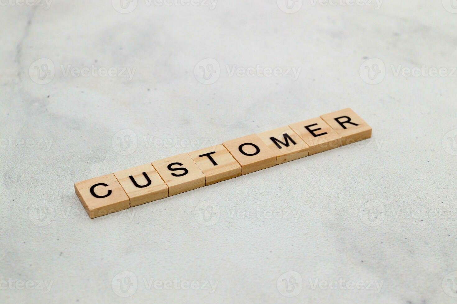 Top view of Customer word on wooden cube letter block on white ...