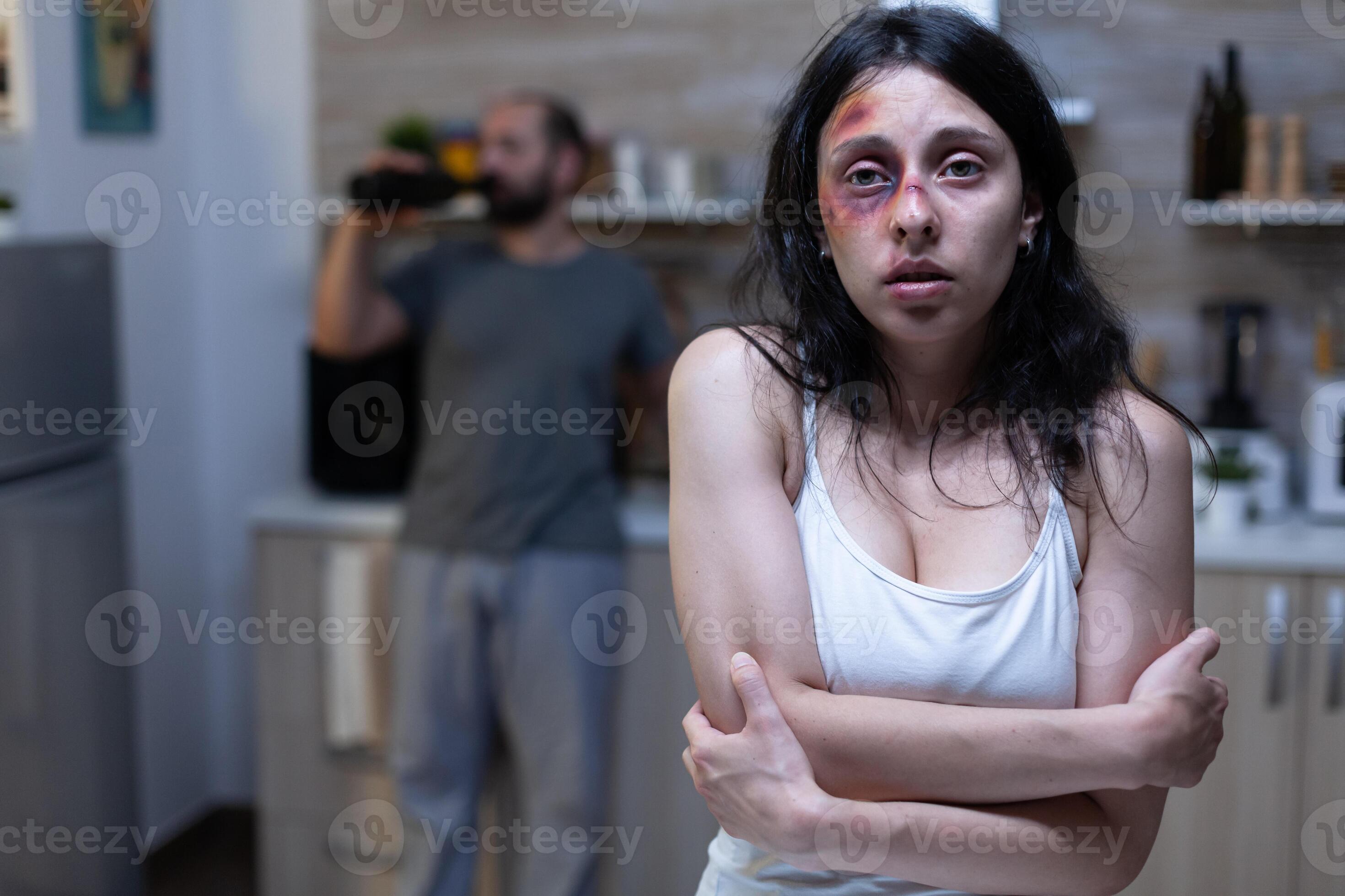 Angry husband getting physical with abused wife while drinking and dealing with alcohol ...