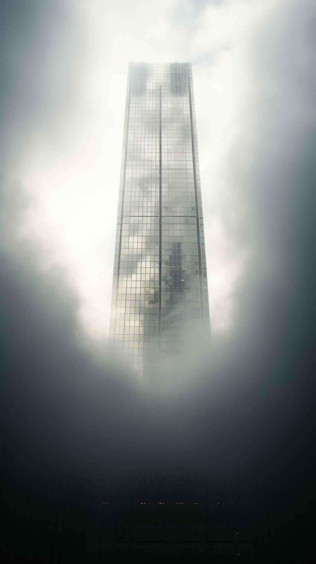 AI generated skyscraper piercing through a blanket of clouds, the power and ambition of modern ...