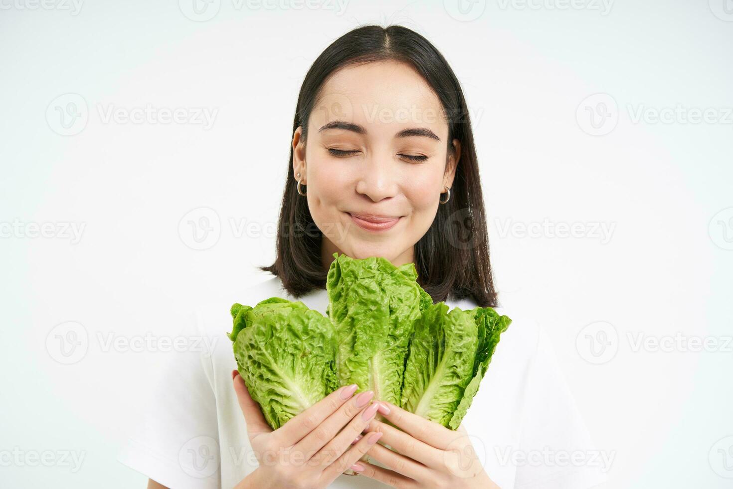 Smiling Asian Woman Vegan Eating Cabbage Enjoys Tasty Fresh Lettuce