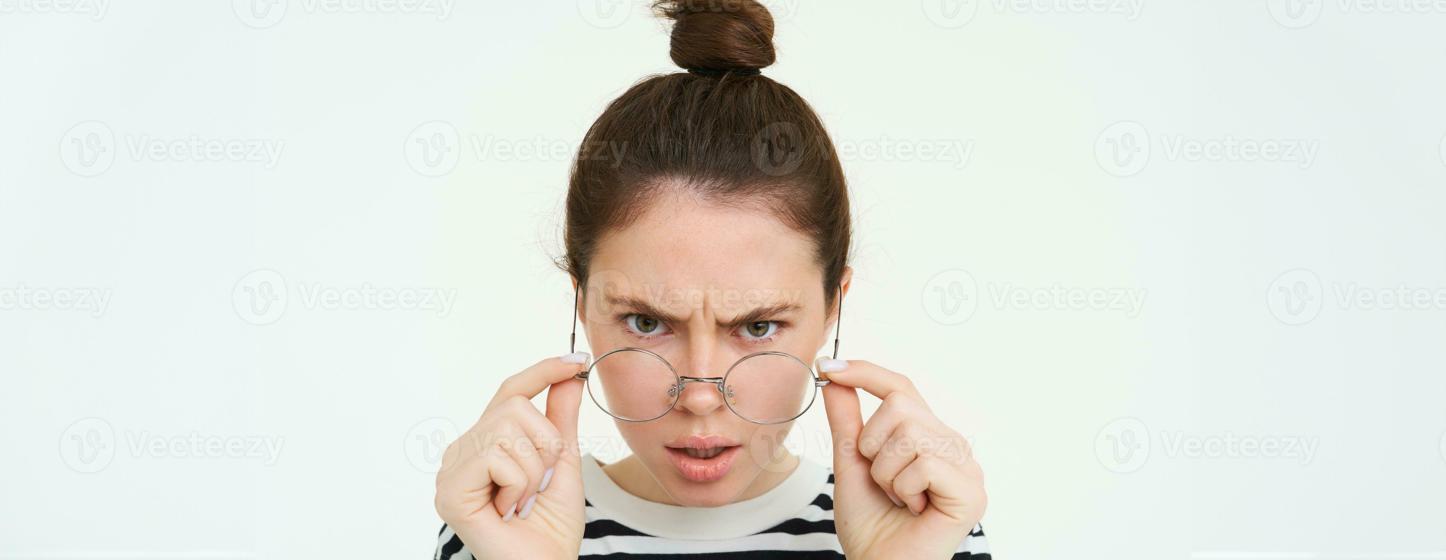 Portrait Of Shocked Angry Woman Frowning Looks Confused At Camera